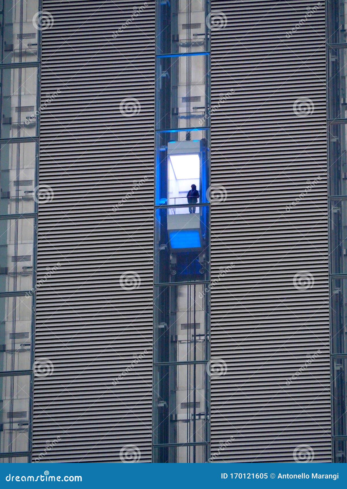 Skyscraper External Elevator with Persons Silhouette Inside Stock Image ...