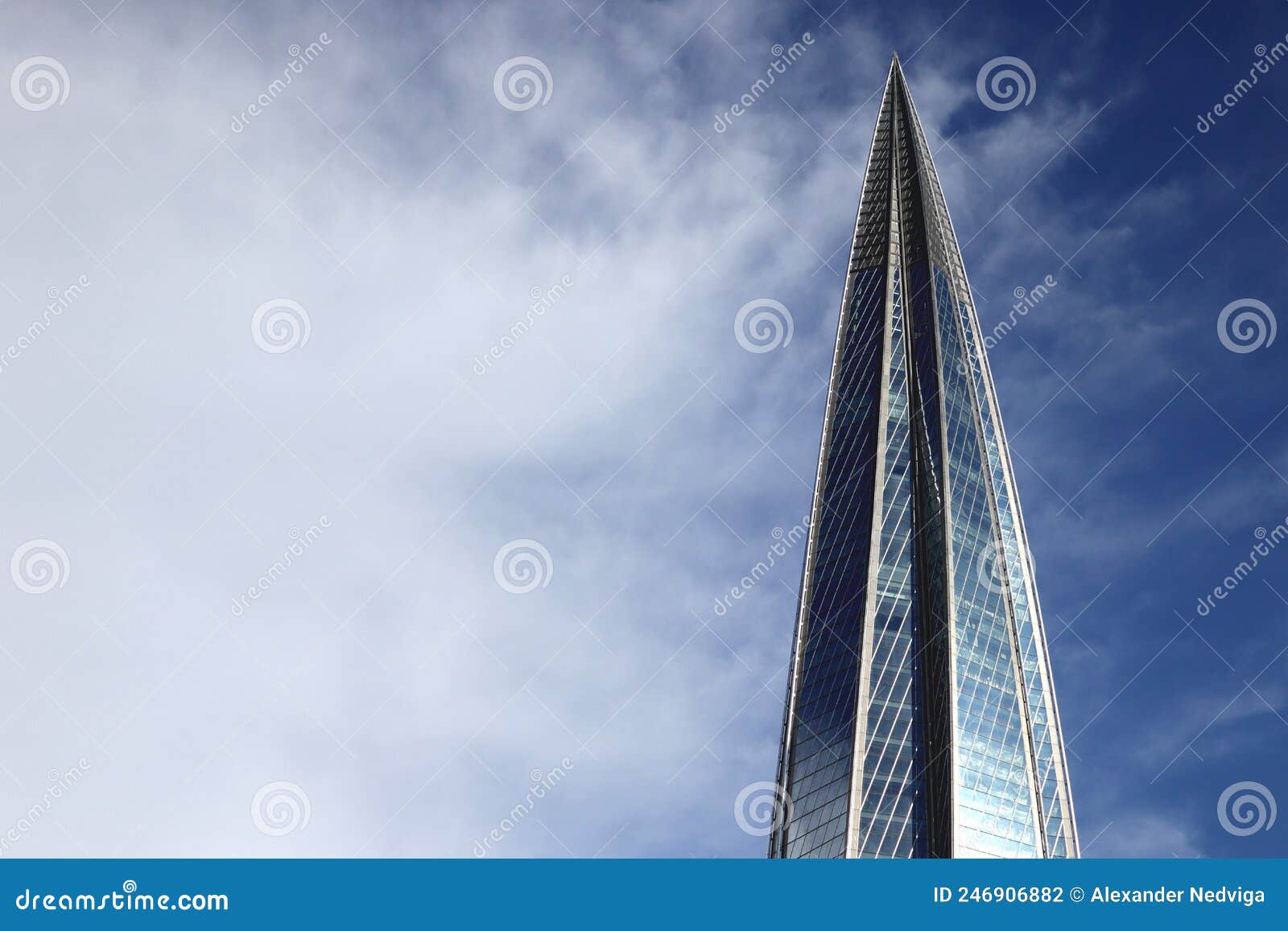 A Skyscraper in the Form of a Sharp Cone Directed Upward Against a ...