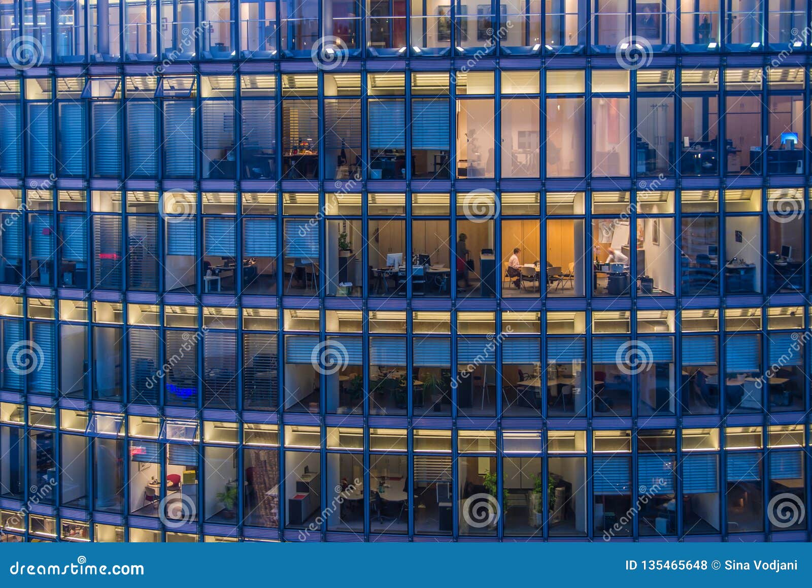Skyscraper Office Windows and Office Worker by Night Editorial Stock ...