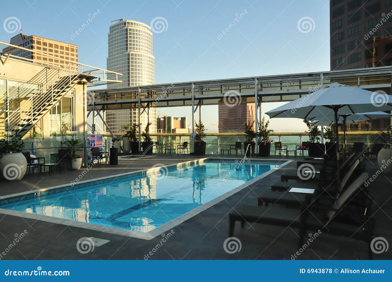 Skyscraper and pool stock photo. Image of chair, holiday - 6943878