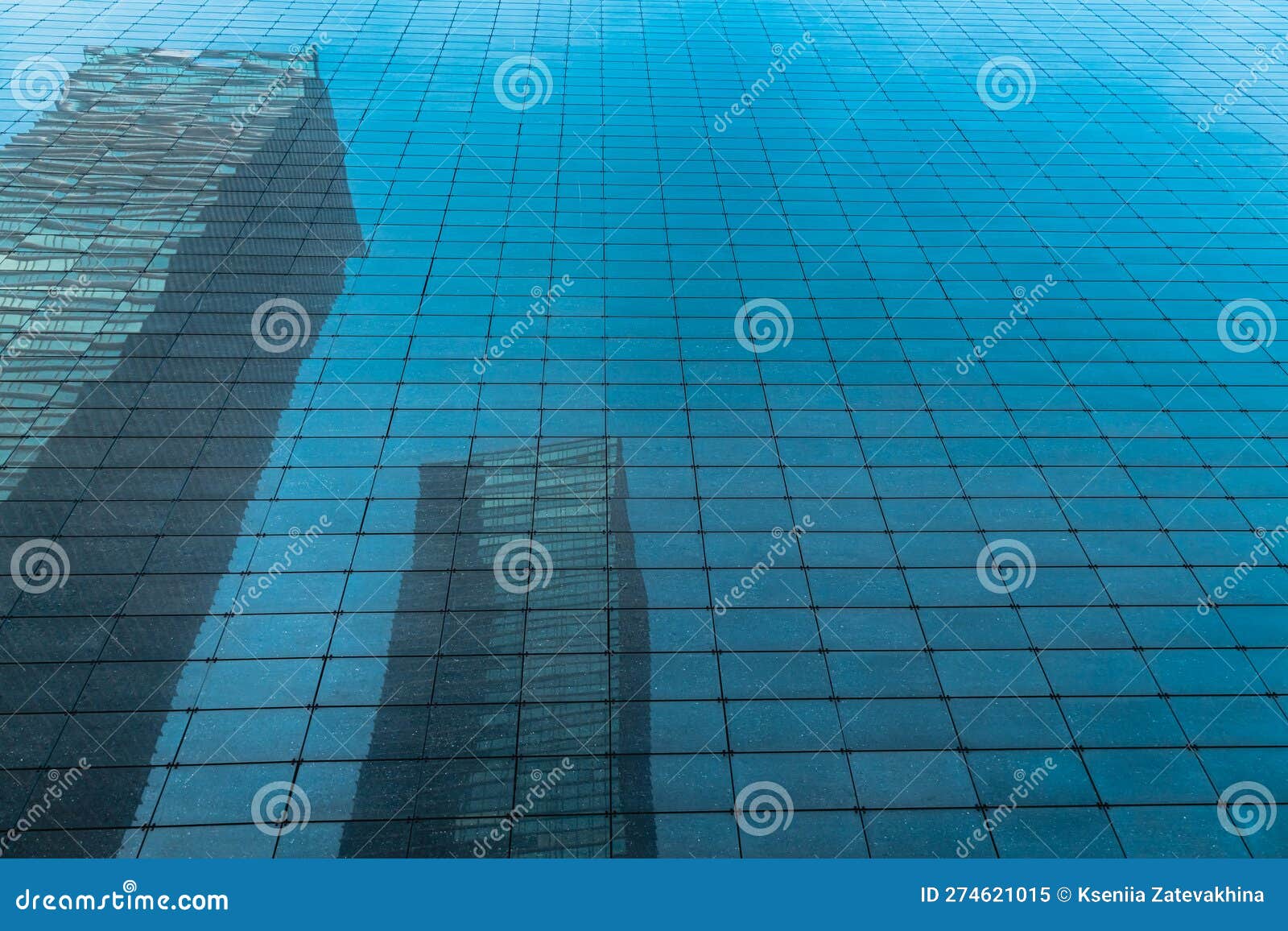 The Skyscraper is Reflected in the Windows of the Facade of a Modern ...