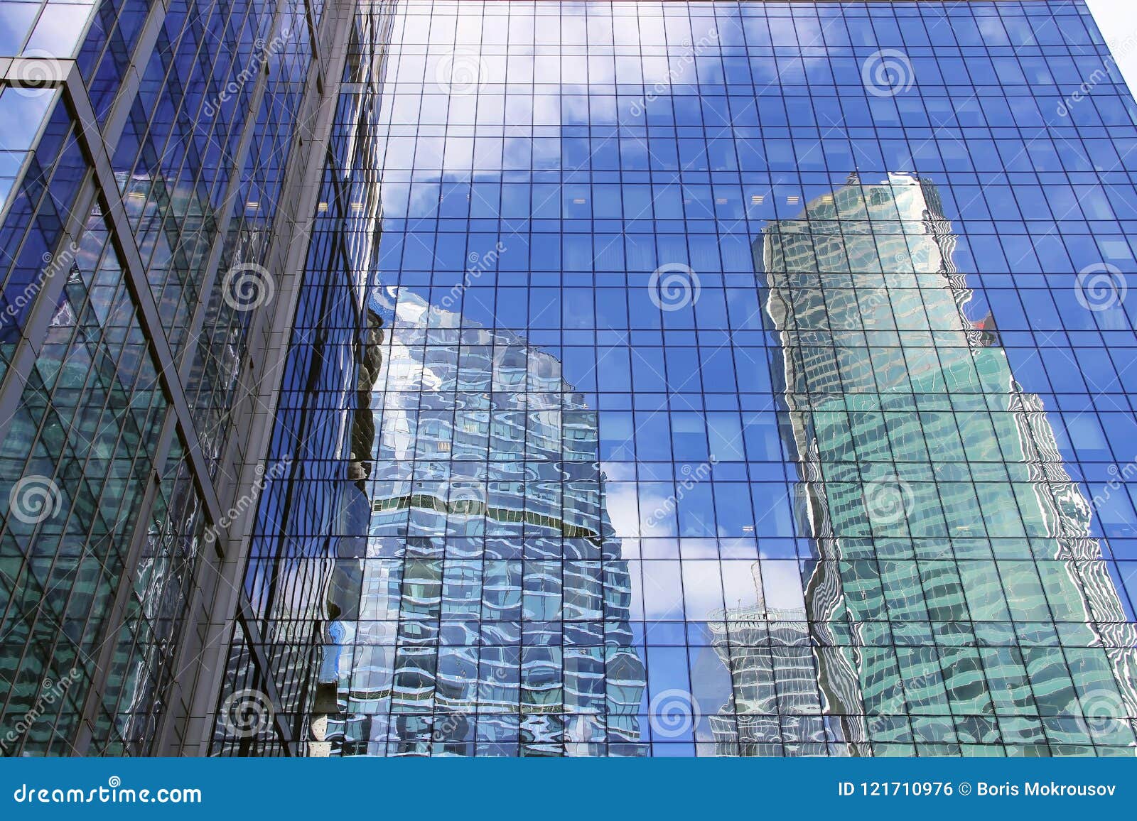 The Skyscraper with the Reflection of the Blue Sky in the Windows Stock ...