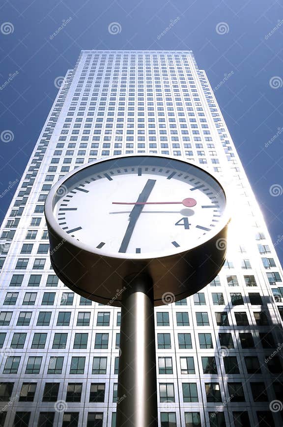 A Skyscraper and Street Clocks Stock Image - Image of metal, glass ...