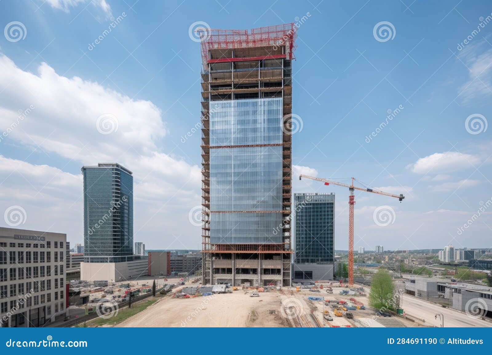 Skyscraper Undergoing Construction, with Workers and Equipment Visible ...