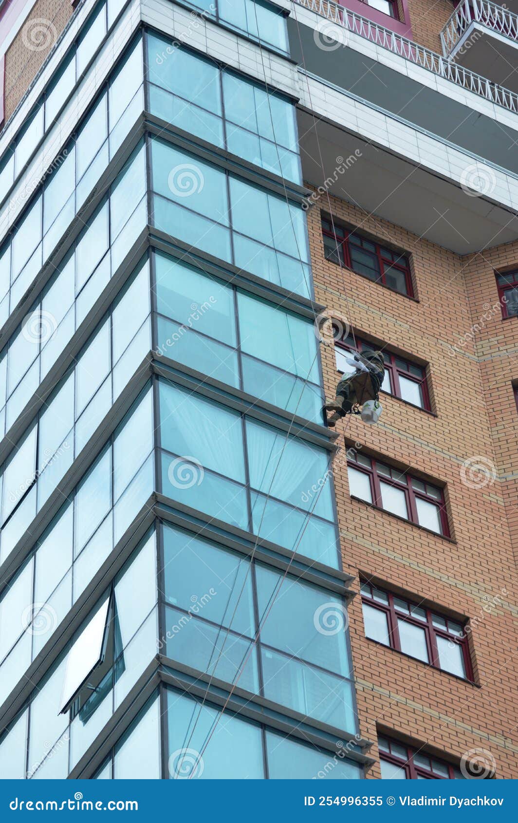Skyscraper window cleaning stock image. Image of blue - 254996355