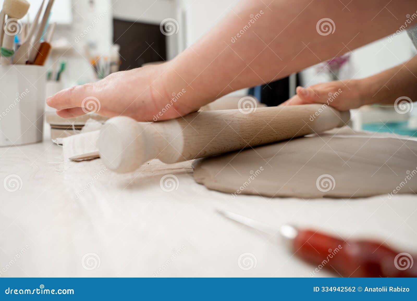 Slab Building Method in Ceramics Crafting. Using a Wooden Stick To Roll ...