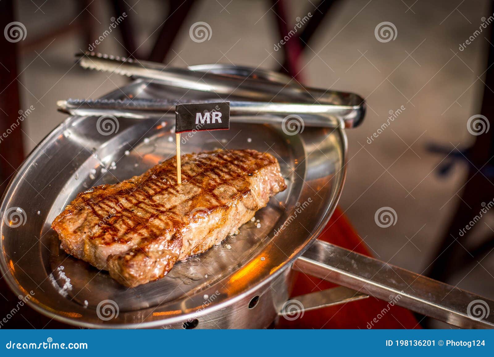 A Slab of Ribeye Beef Steak Done To Medium Rare Served on a Plate Stock ...