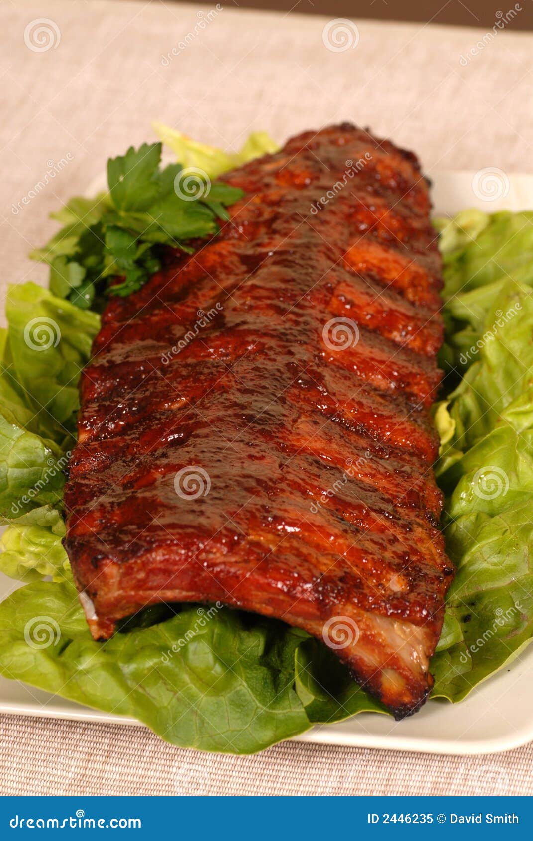 Slab of ribs on lettuce stock image. Image of meat, food - 2446235