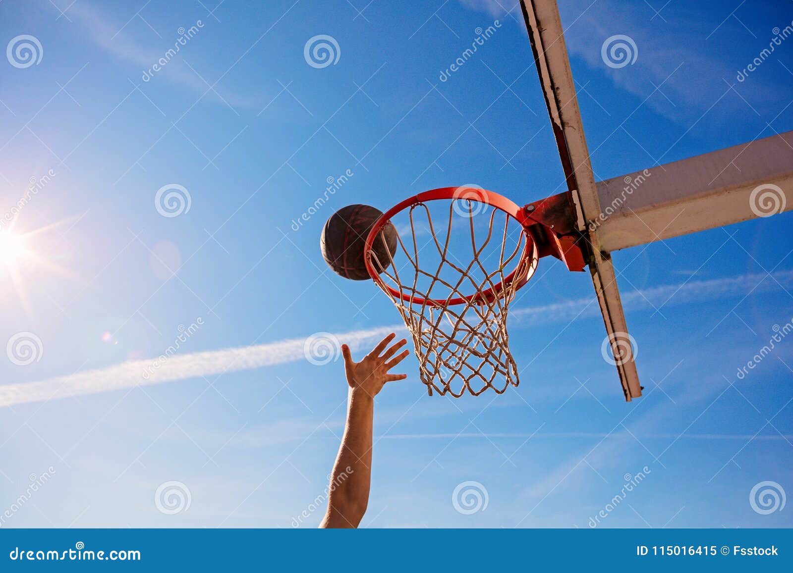 Slam Dunk. Side View of Young Basketball Player Making Slam Dunk Stock ...