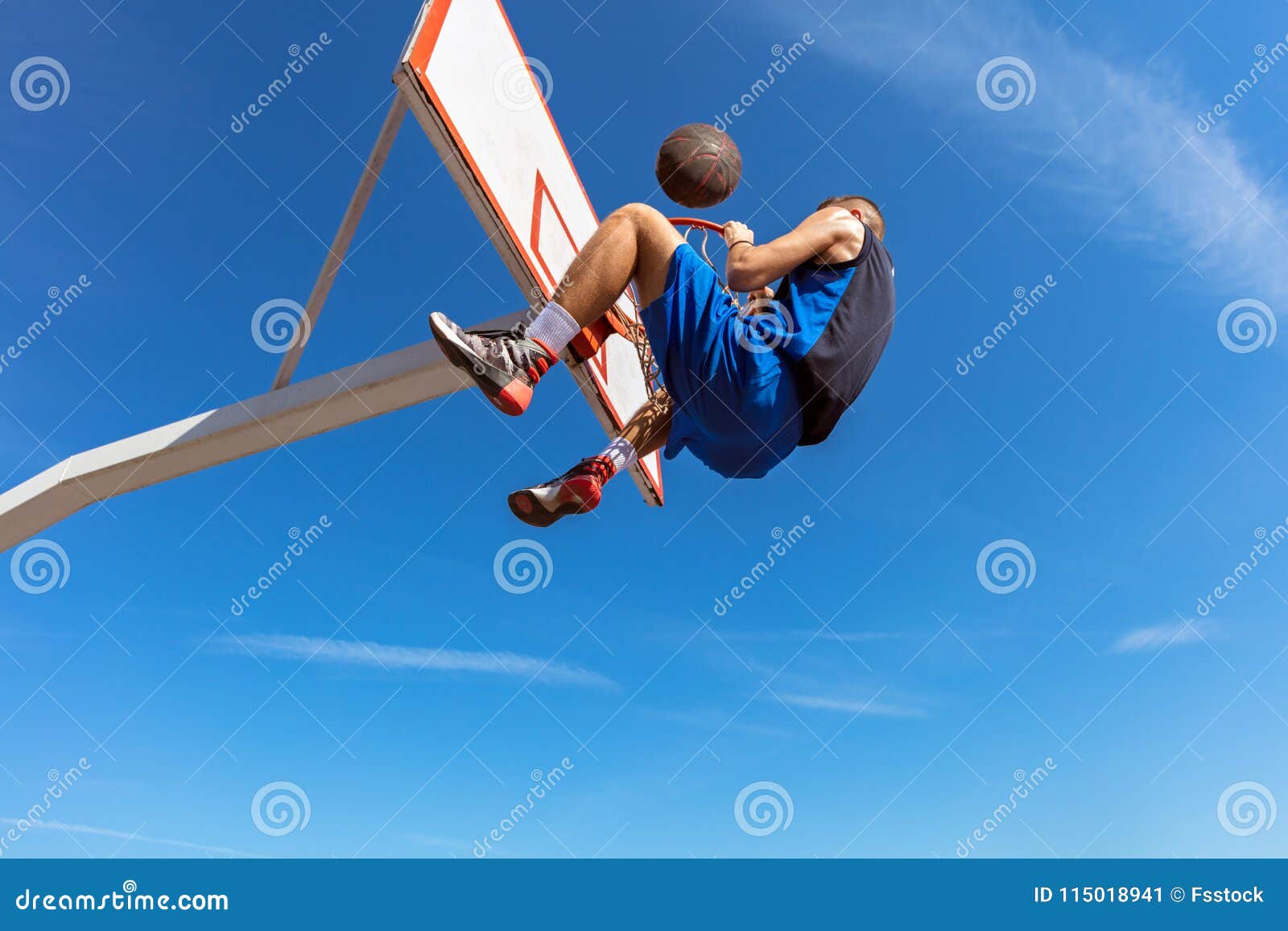 Slam Dunk. Side View of Young Basketball Player Making Slam Dunk Stock ...