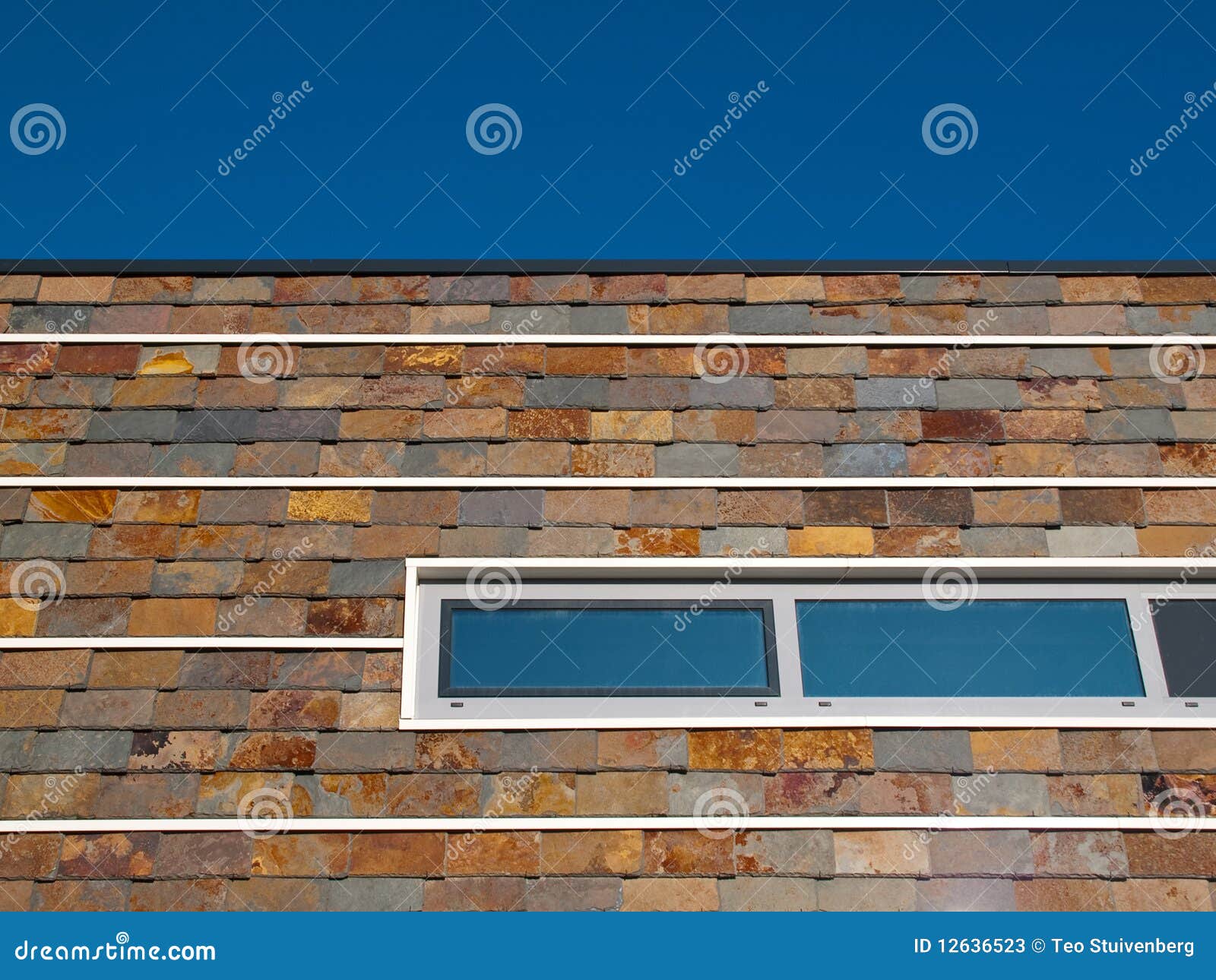 Slate Facade With Yellow Luminous Window With Privacy Screen And Grid ...