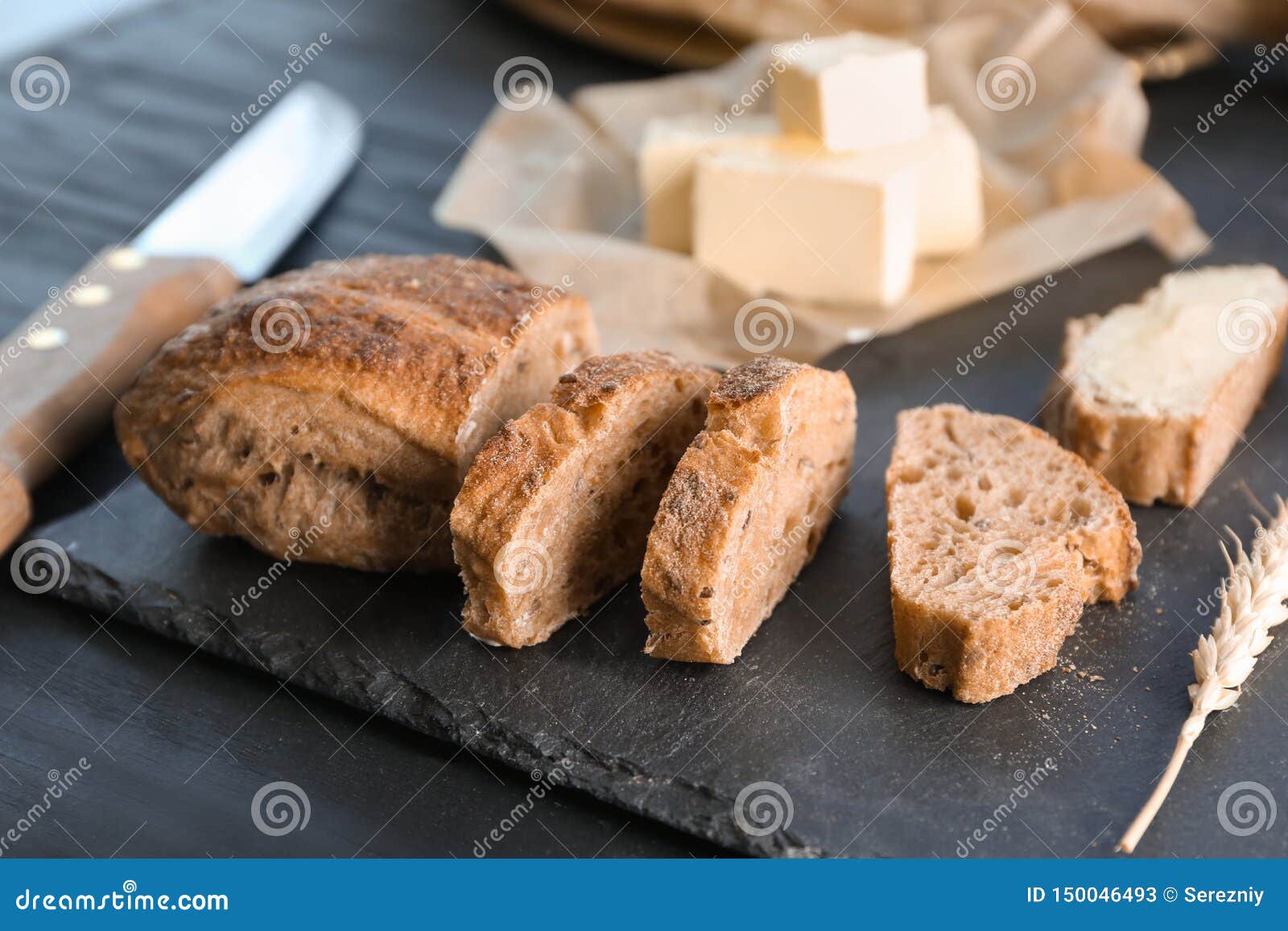 Slate Plate with Freshly Baked Bread on Table Stock Image - Image of ...