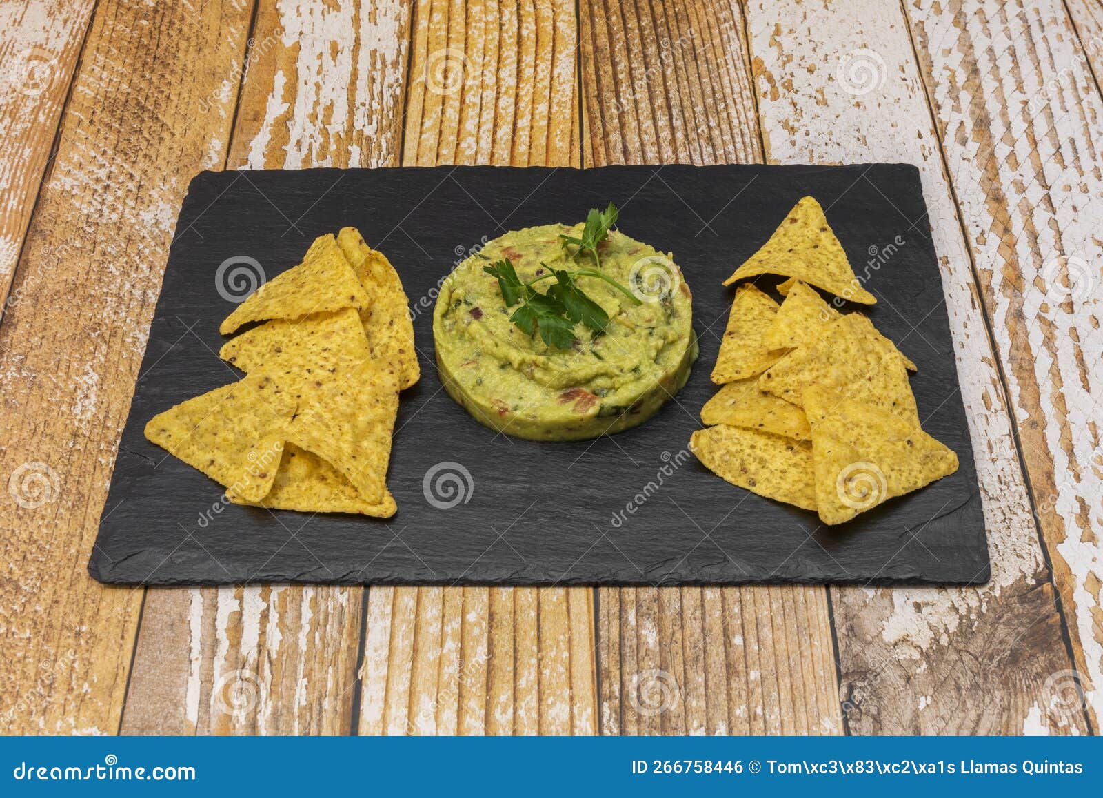 A Slate Tray with an Appetizer of Mexican Guacamole with Corn Tortilla ...