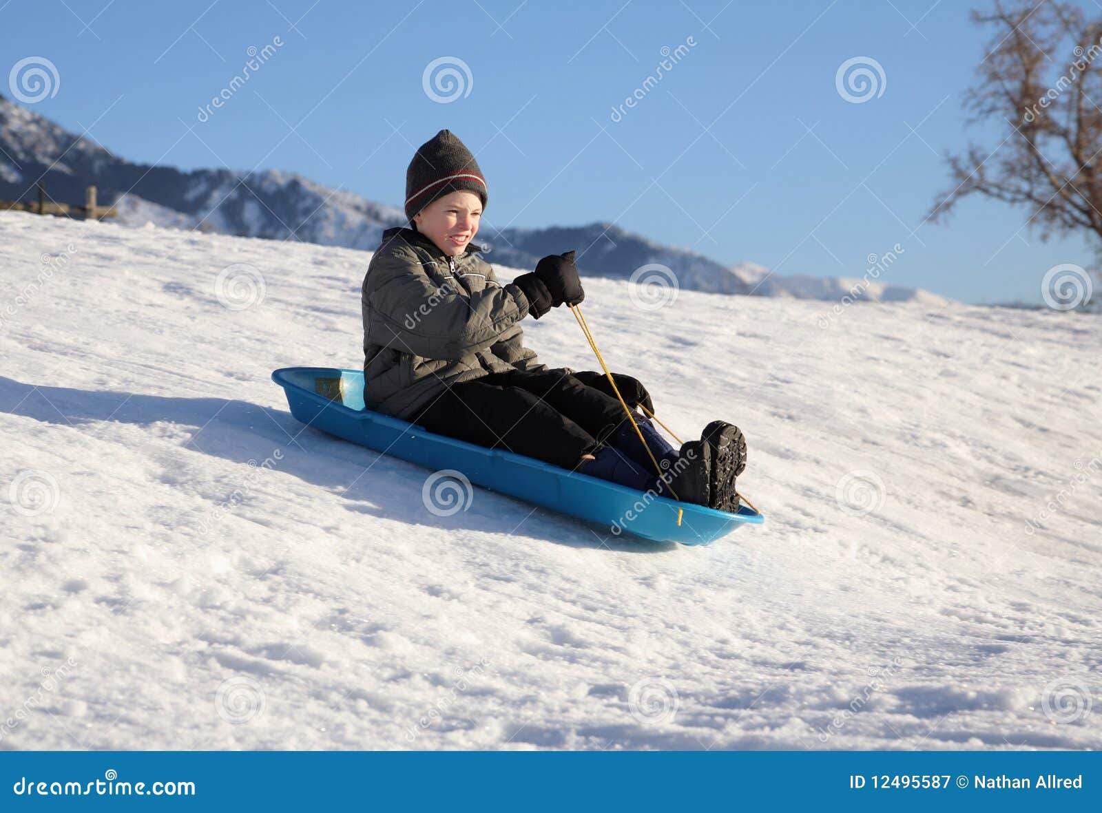 Sledding fun stock image. Image of enjoyment, alone, action - 12495587