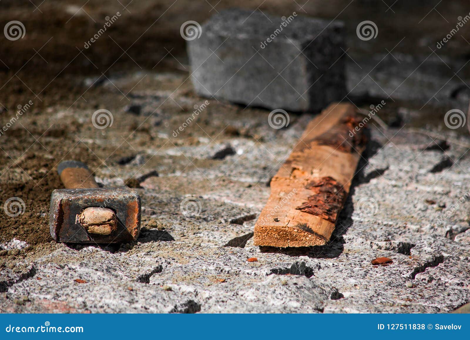 A Sledgehammer with a Board Lay on the Paving Under Construction Stock ...