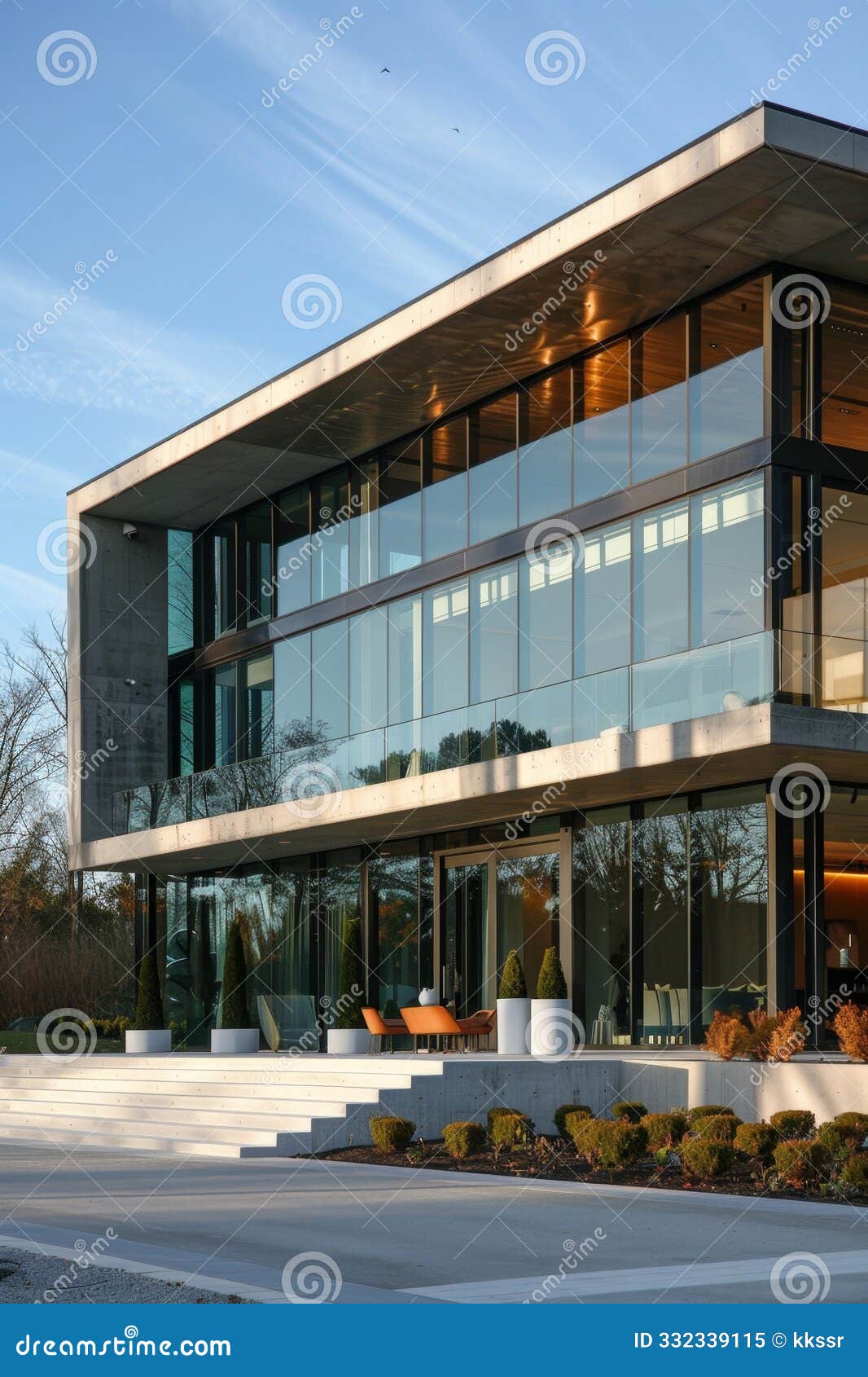 Sleek Contemporary Building with Large Glass Windows and Raw Concrete ...