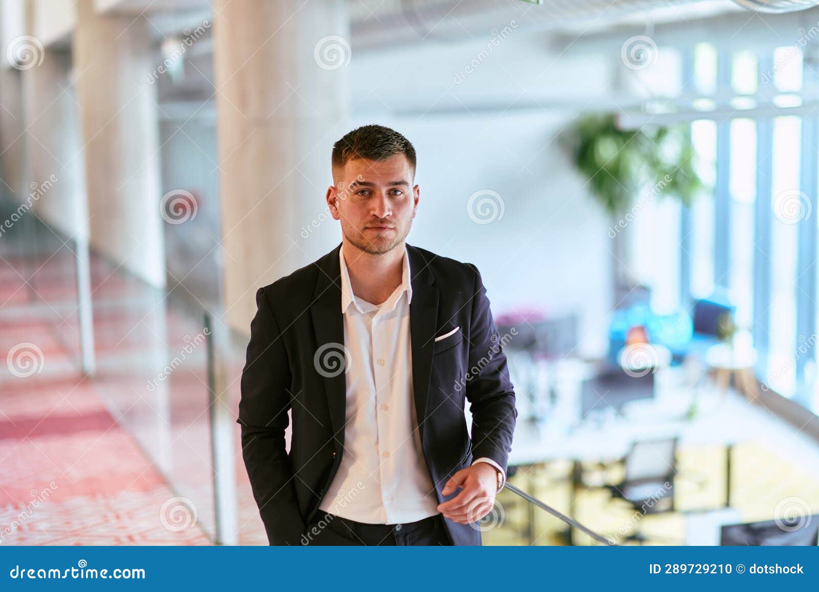 In a Sleek Corporate Setting, the Young and Charismatic Director ...