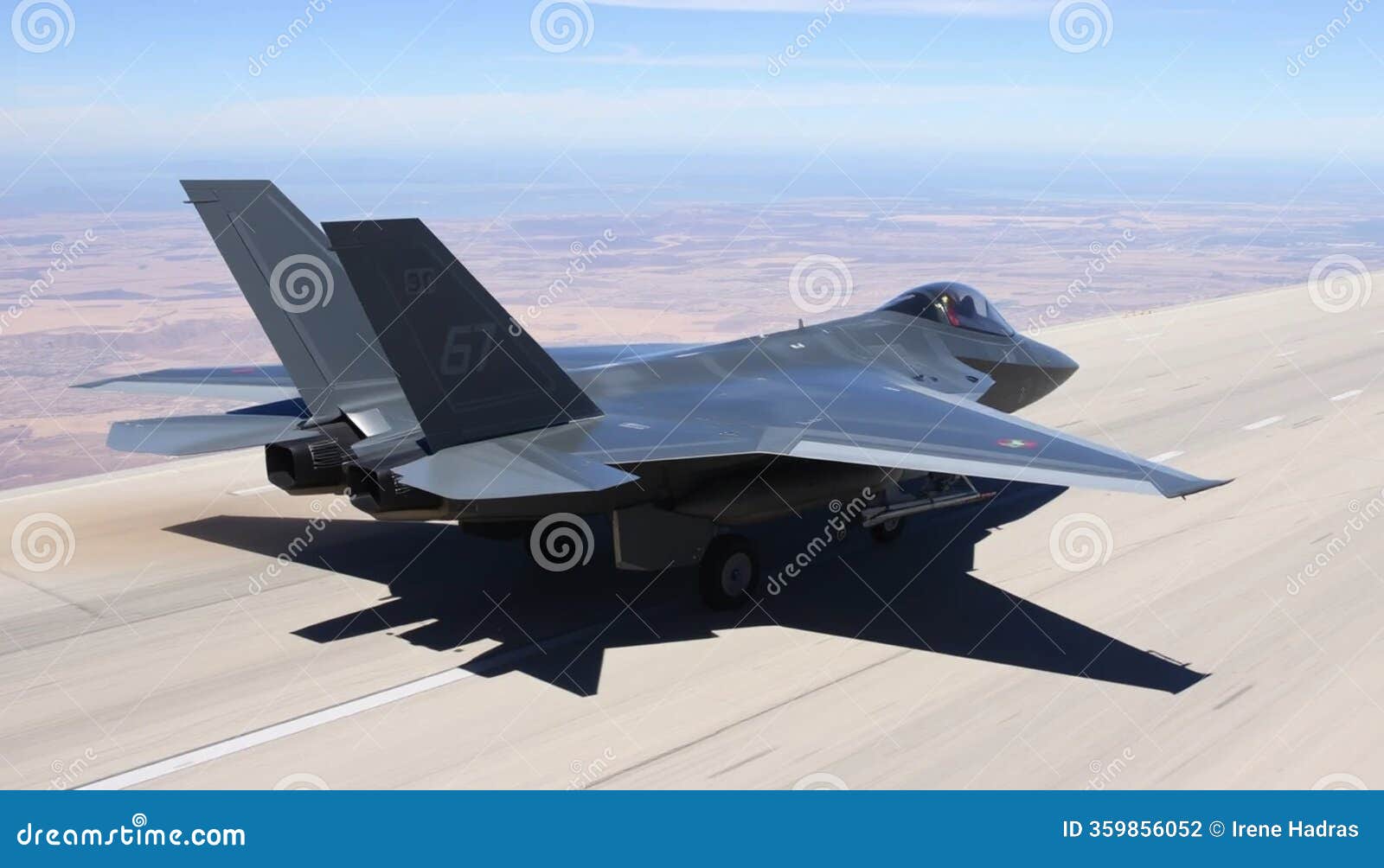 A Sleek, Gray Fighter Jet with Angular Wings and Dual Vertical ...