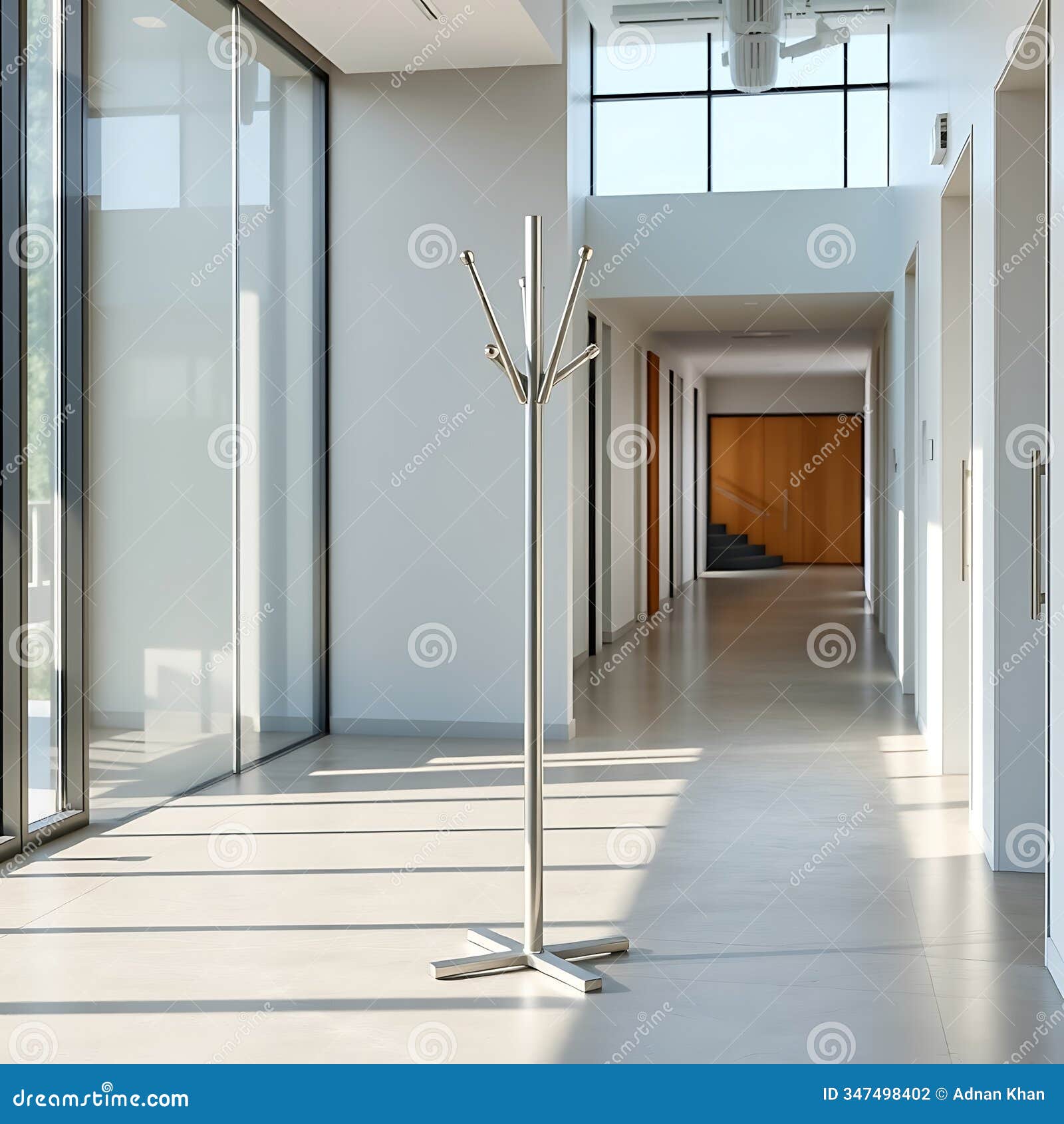 A Sleek Metallic Coat Rack with Angular Design in a Contemporary Office ...