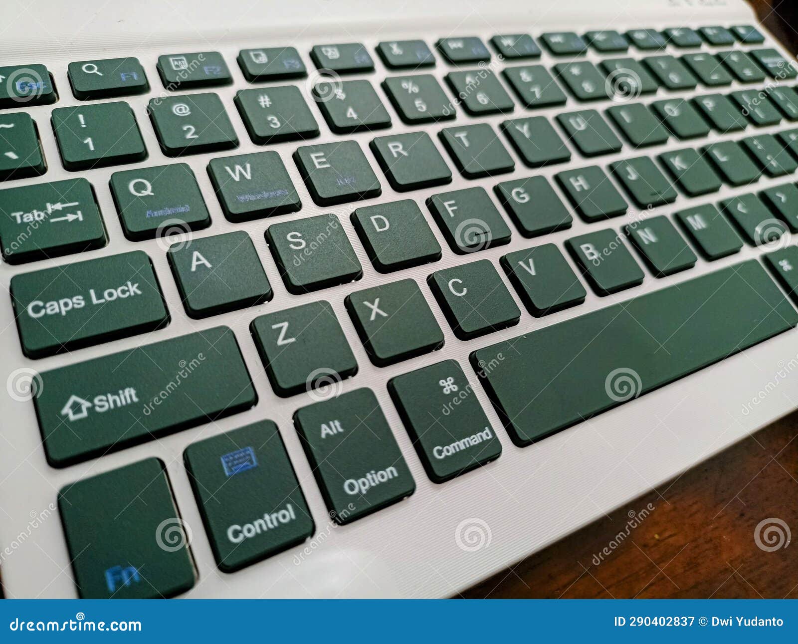 Sleek Simplicity: Wireless Keyboard in White with Dark Green Keys Stock ...