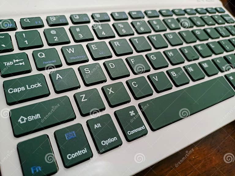 Sleek Simplicity: Wireless Keyboard in White with Dark Green Keys Stock ...
