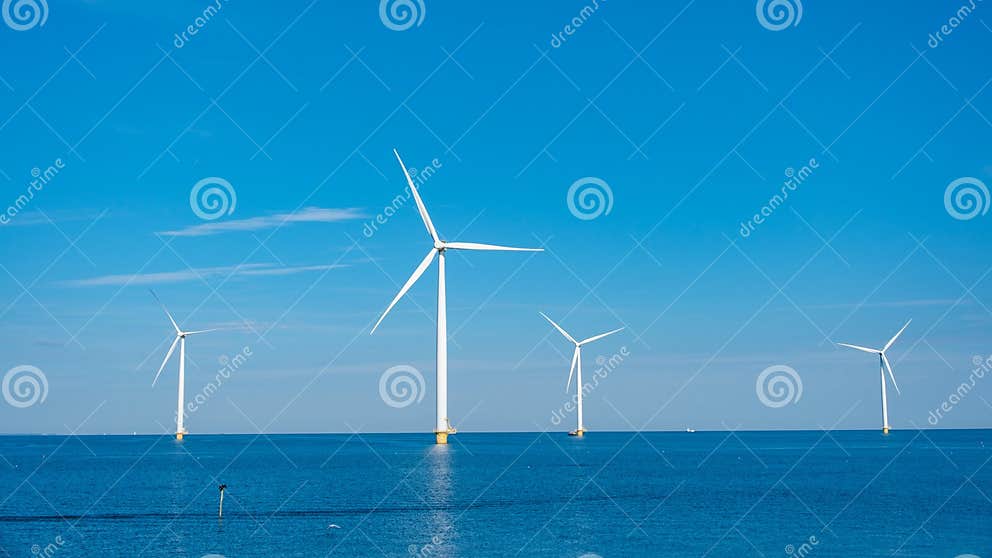 Sleek Wind Turbines Harnessing Green Energy Under the Clear Dutch Sky ... Sleek Wind Turbines Harnessing Green Energy Under the Clear Dutch Sky ...