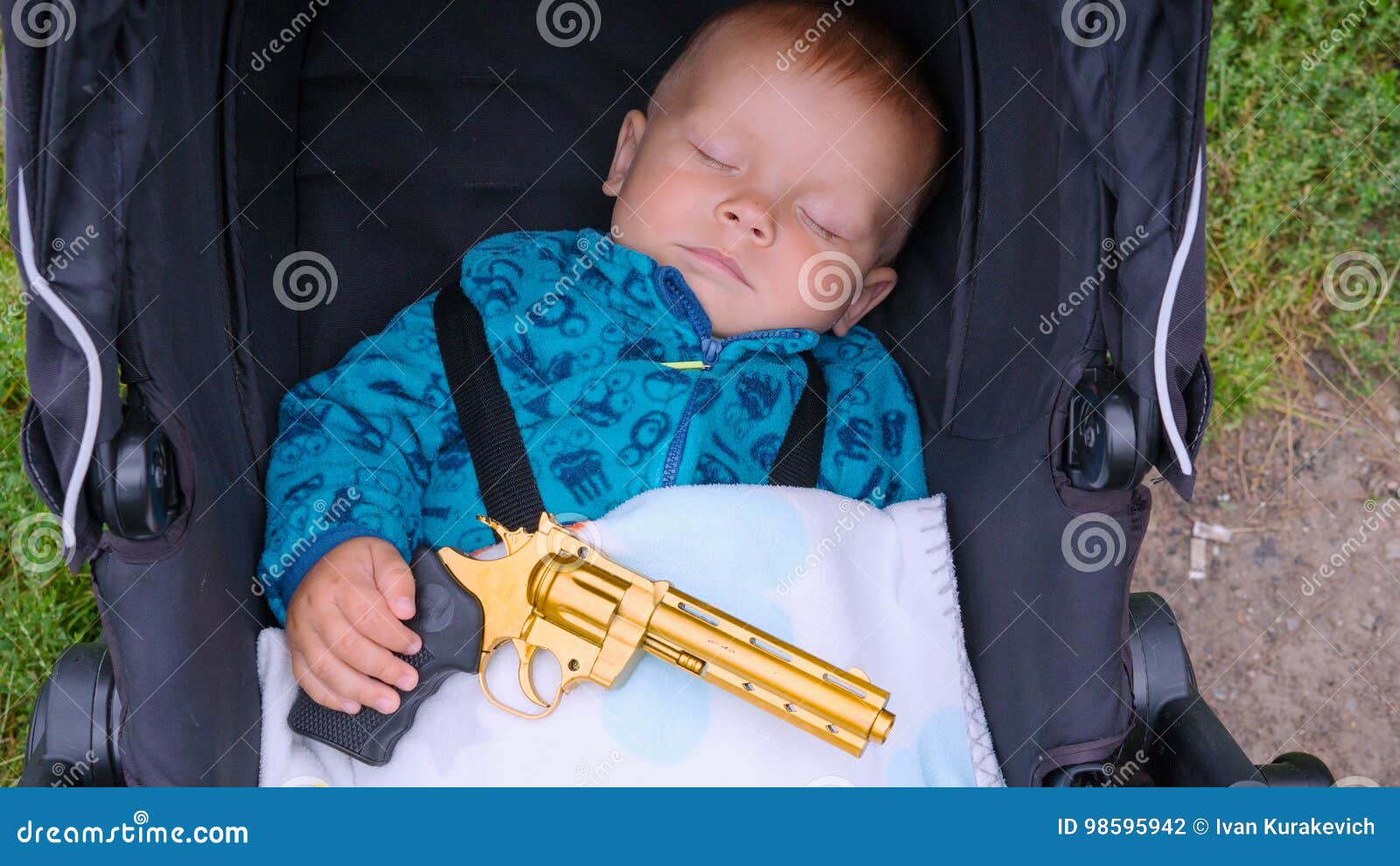 Sleeping Baby with a Gun in His Hands Stock Photo - Image of happy ...