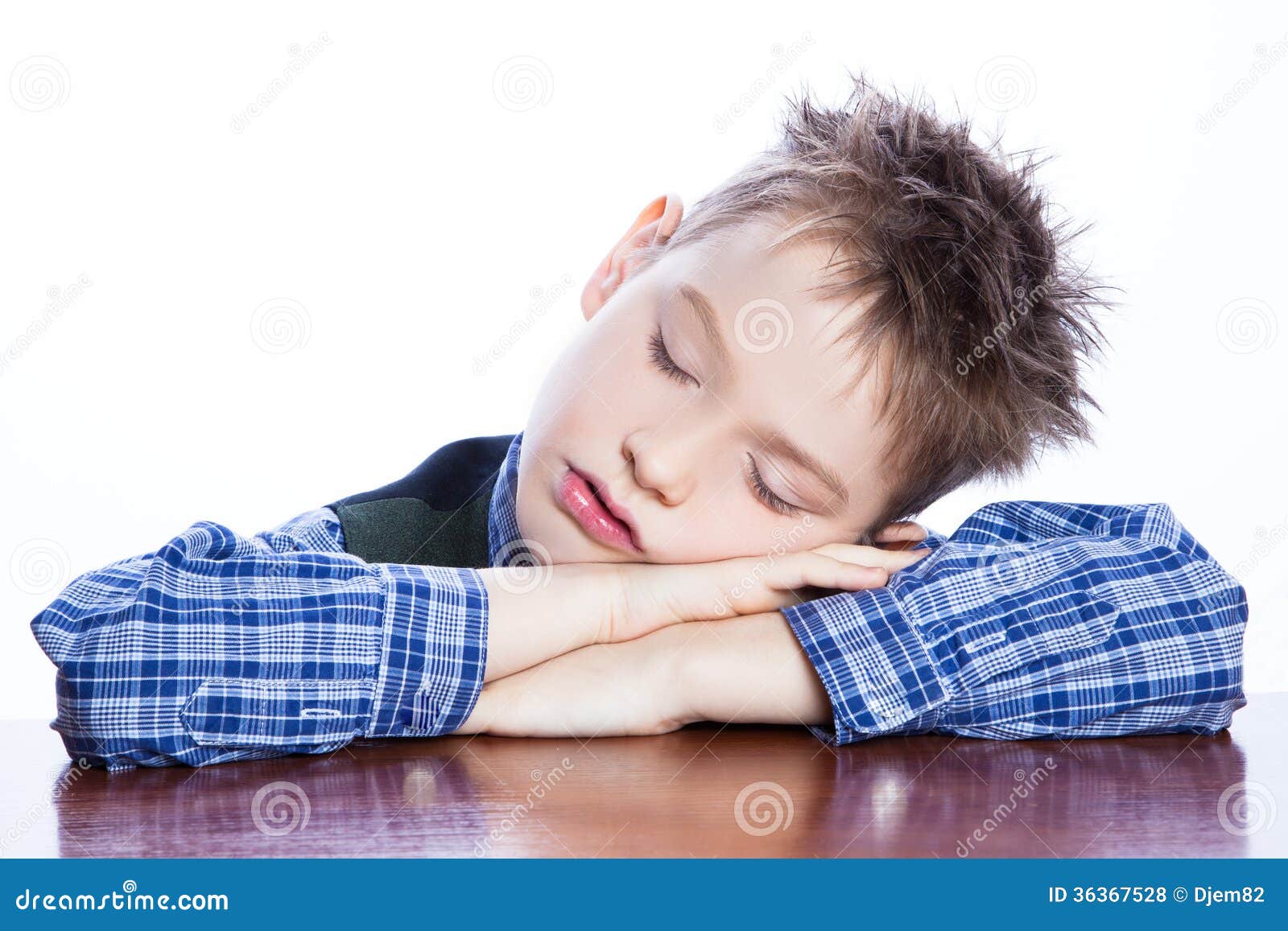 Sleeping boy on the table stock photo. Image of little - 36367528