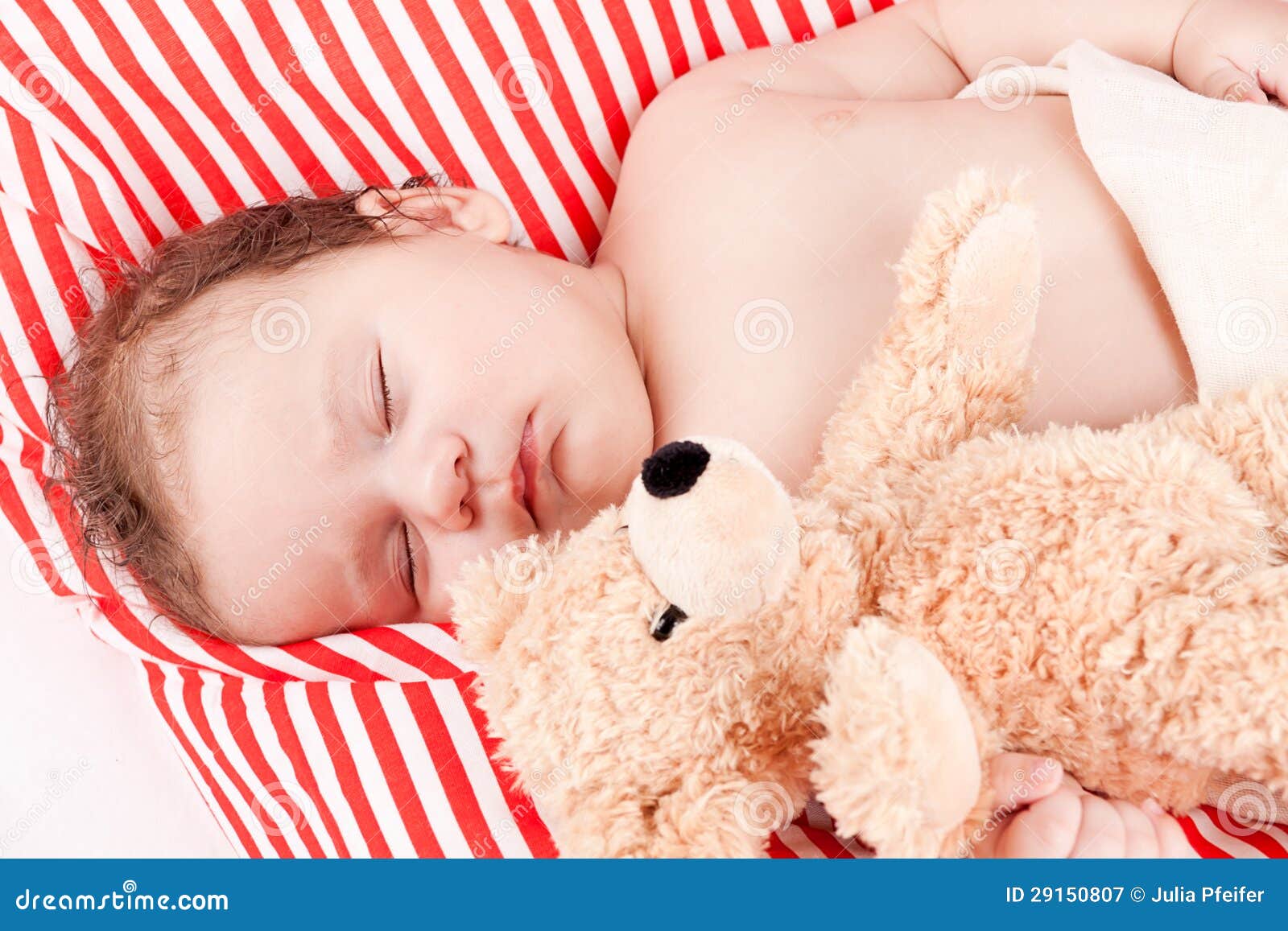 Sleeping Cute Little Baby on Red and White Stripes Pillow Stock Image ...