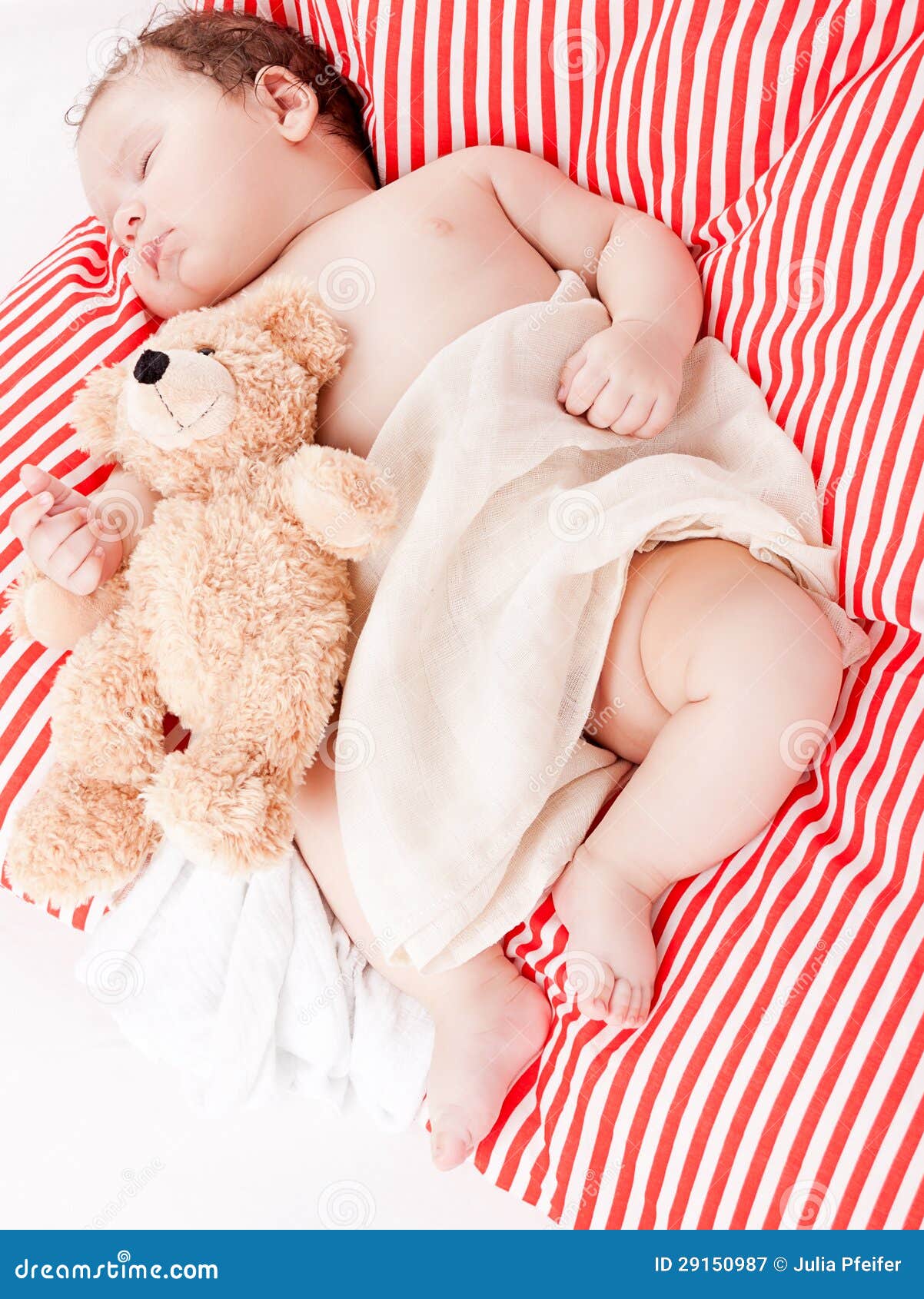 Sleeping Cute Little Baby on Red and White Stripes Pillow Stock Image ...