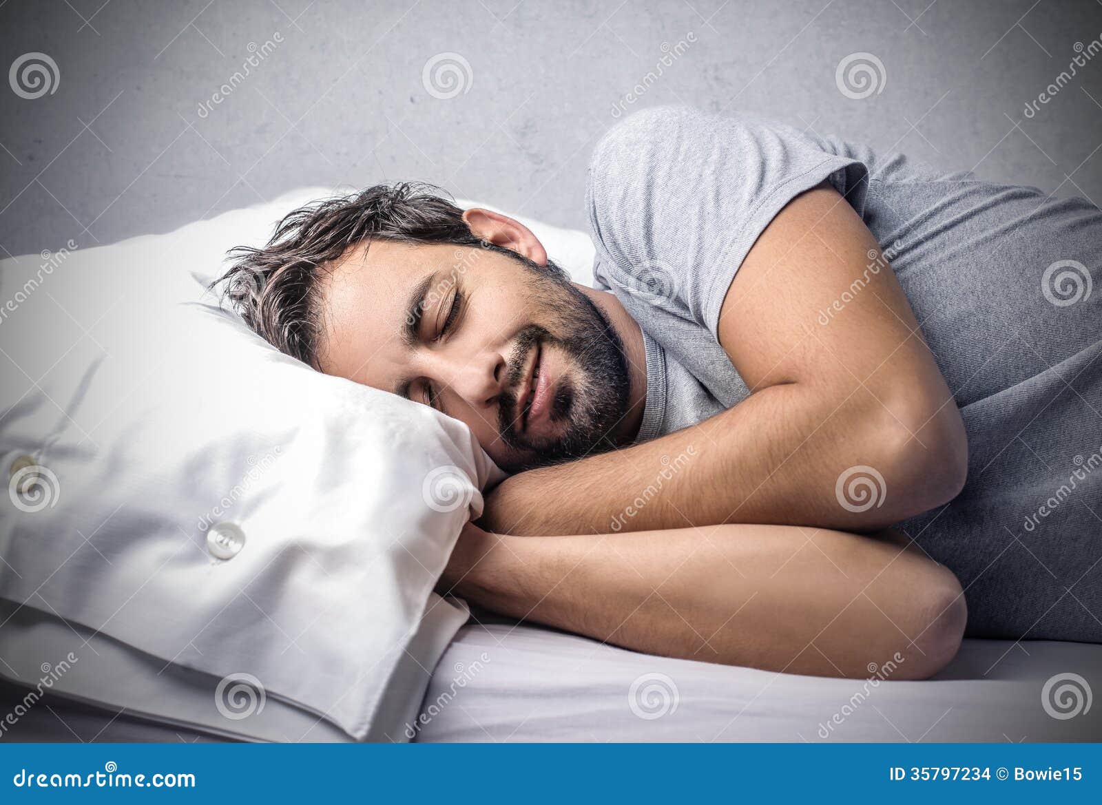 Sleeping man into bed stock photo. Image of wall, young - 35797234