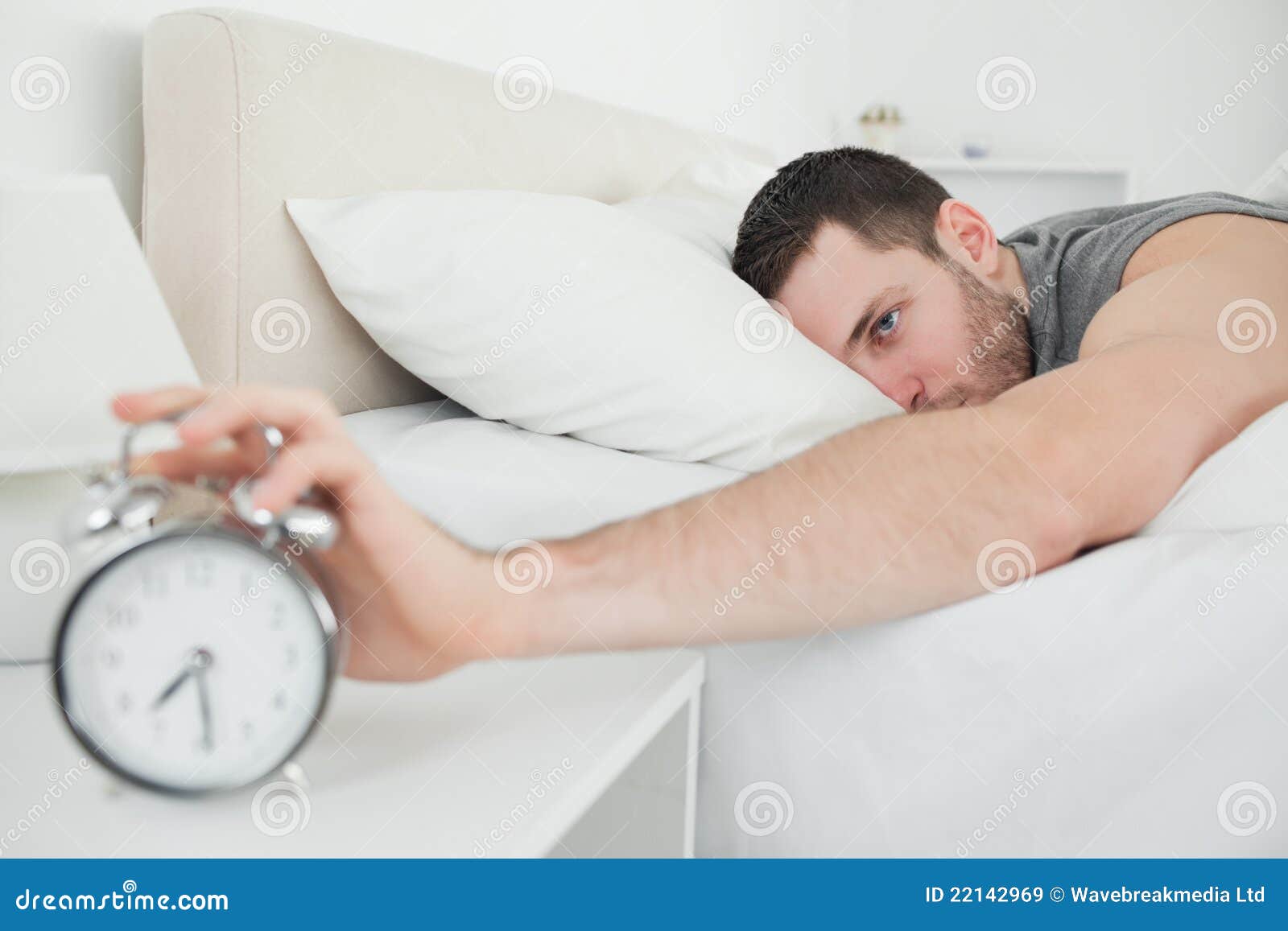 Sleeping Man Being Awakened by an Alarm Clock Stock Image - Image of ...