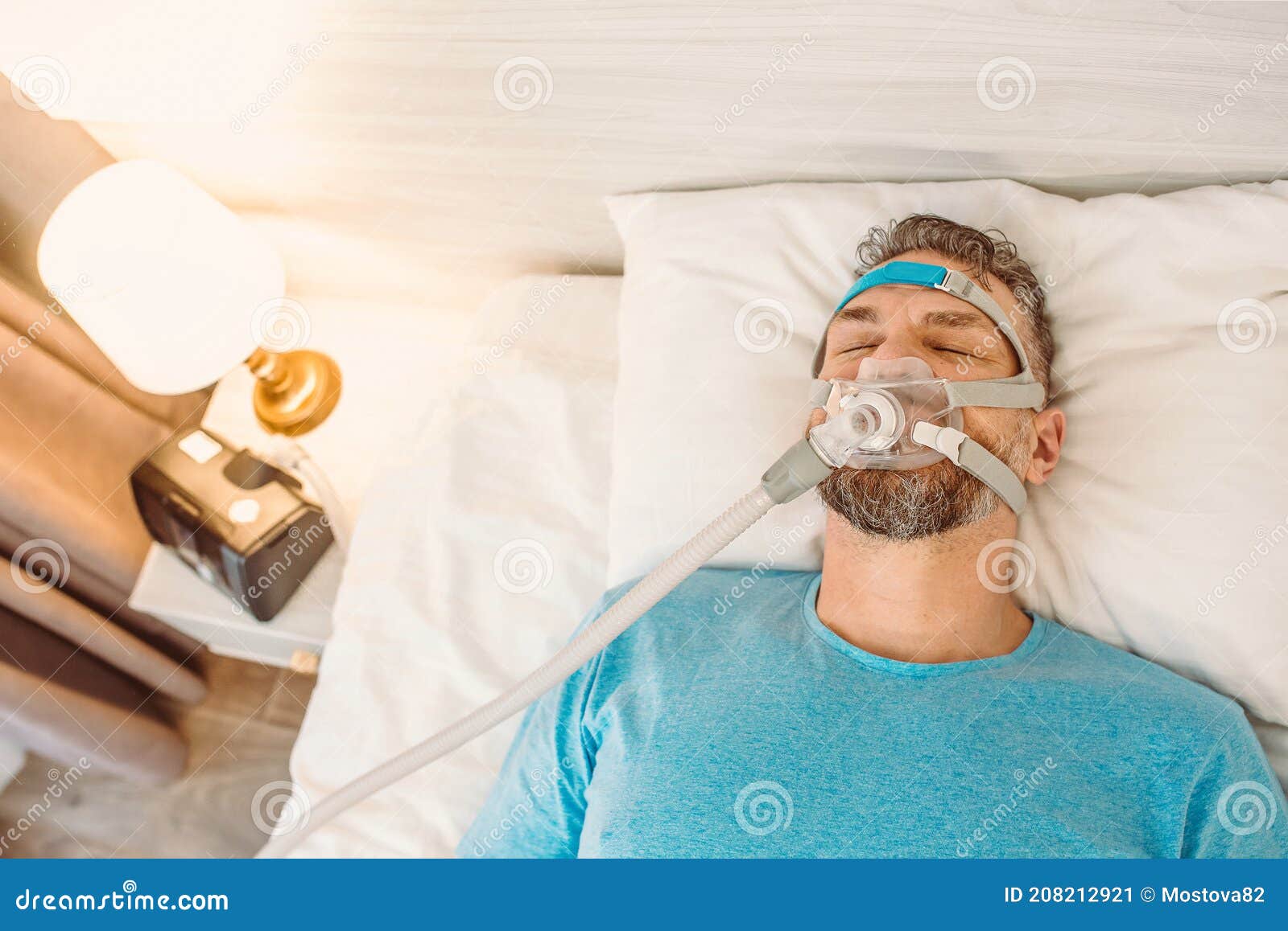 Sleeping Man with Chronic Breathing Issues Considers Using CPAP Machine ...