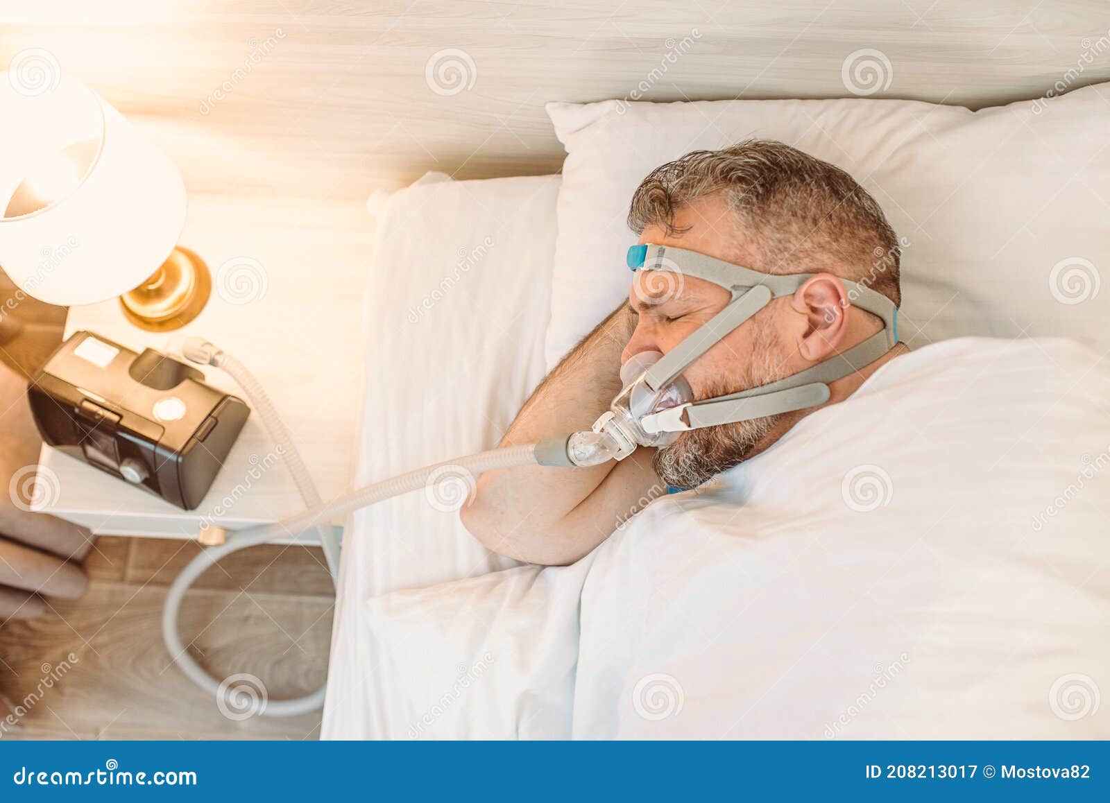 Sleeping Man With Chronic Breathing Issues Considers Using CPAP Machine ...