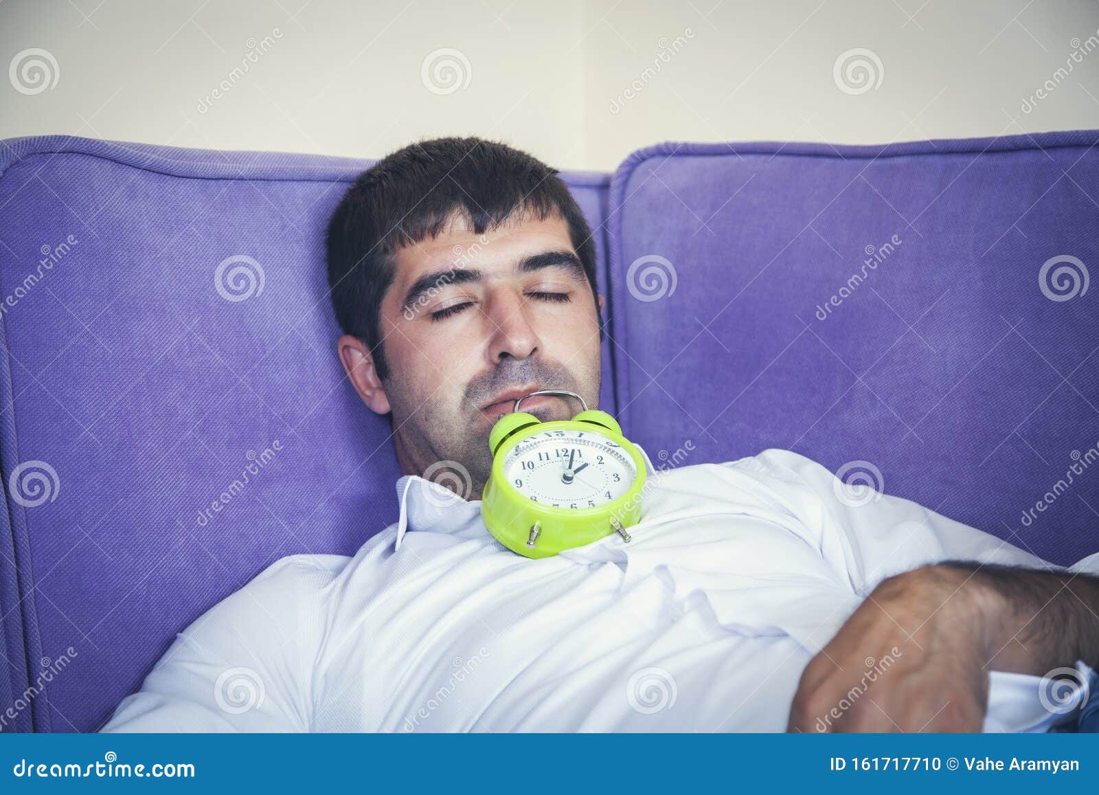 Sleeping man hand on clock stock photo. Image of hand - 161717710