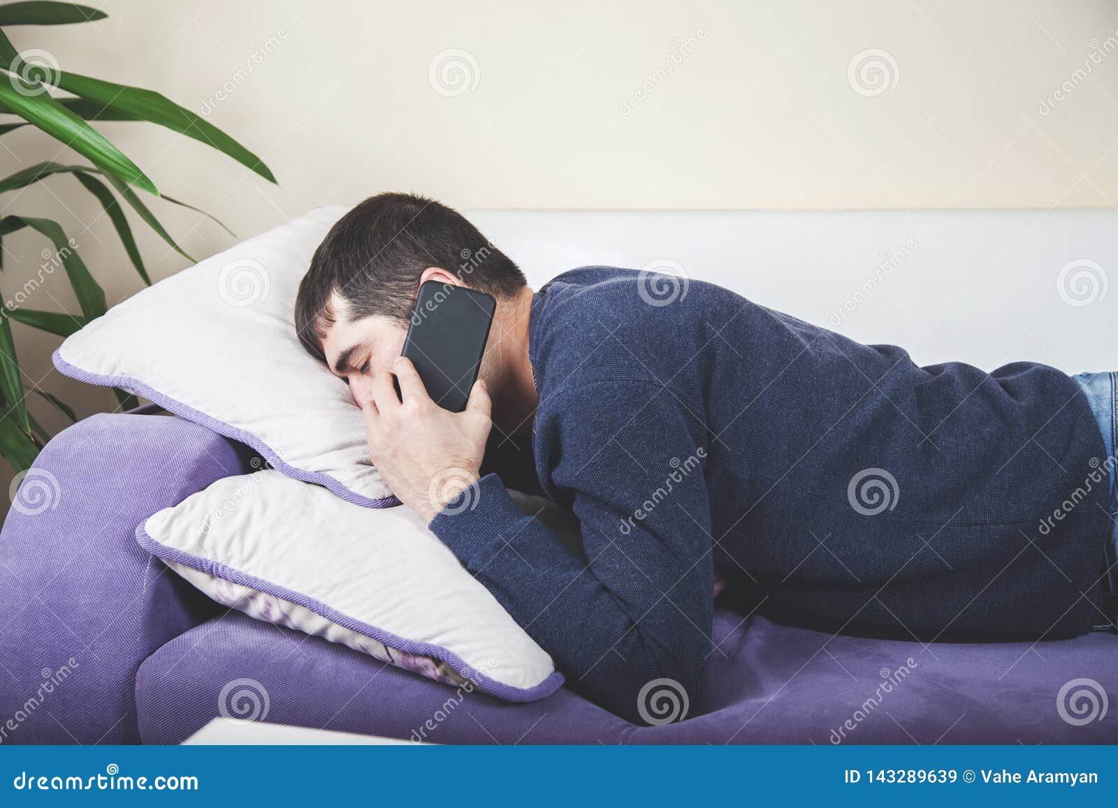 Sleeping man talking phone stock image. Image of male - 143289639