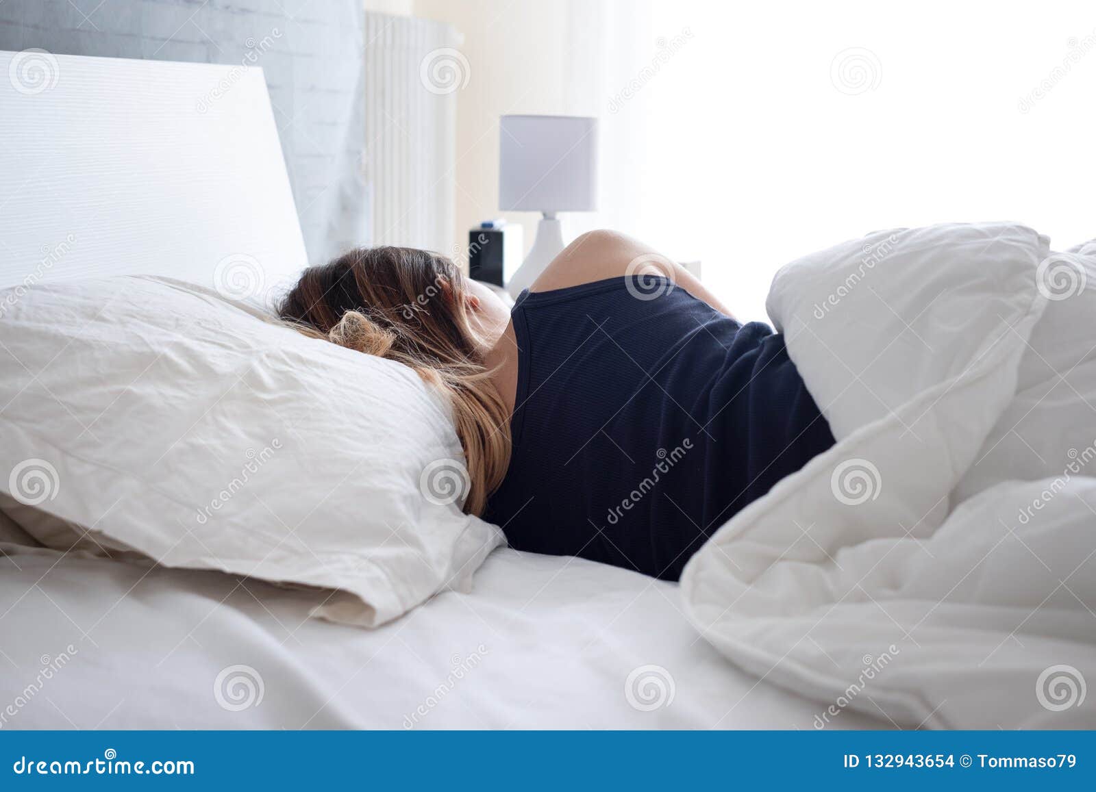 Sleeping Woman in the Morning Window Light Stock Photo - Image of back ...