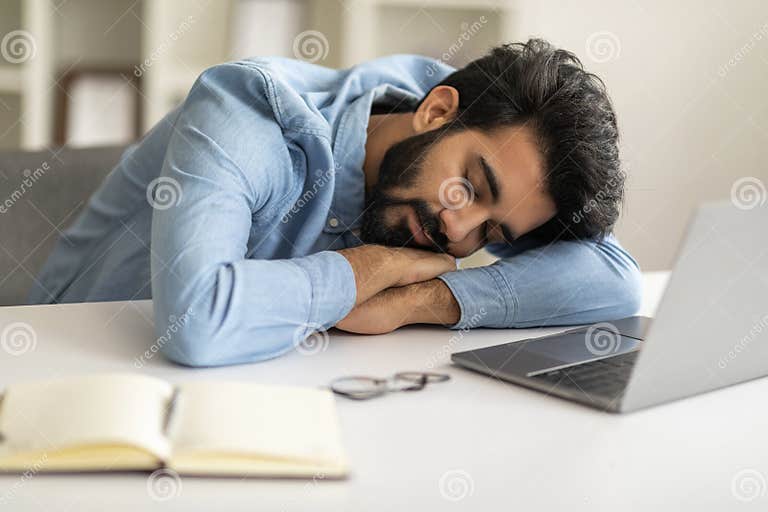 Sleeping at Work. Overworked Freelancer Guy Napping at Workplace at ...