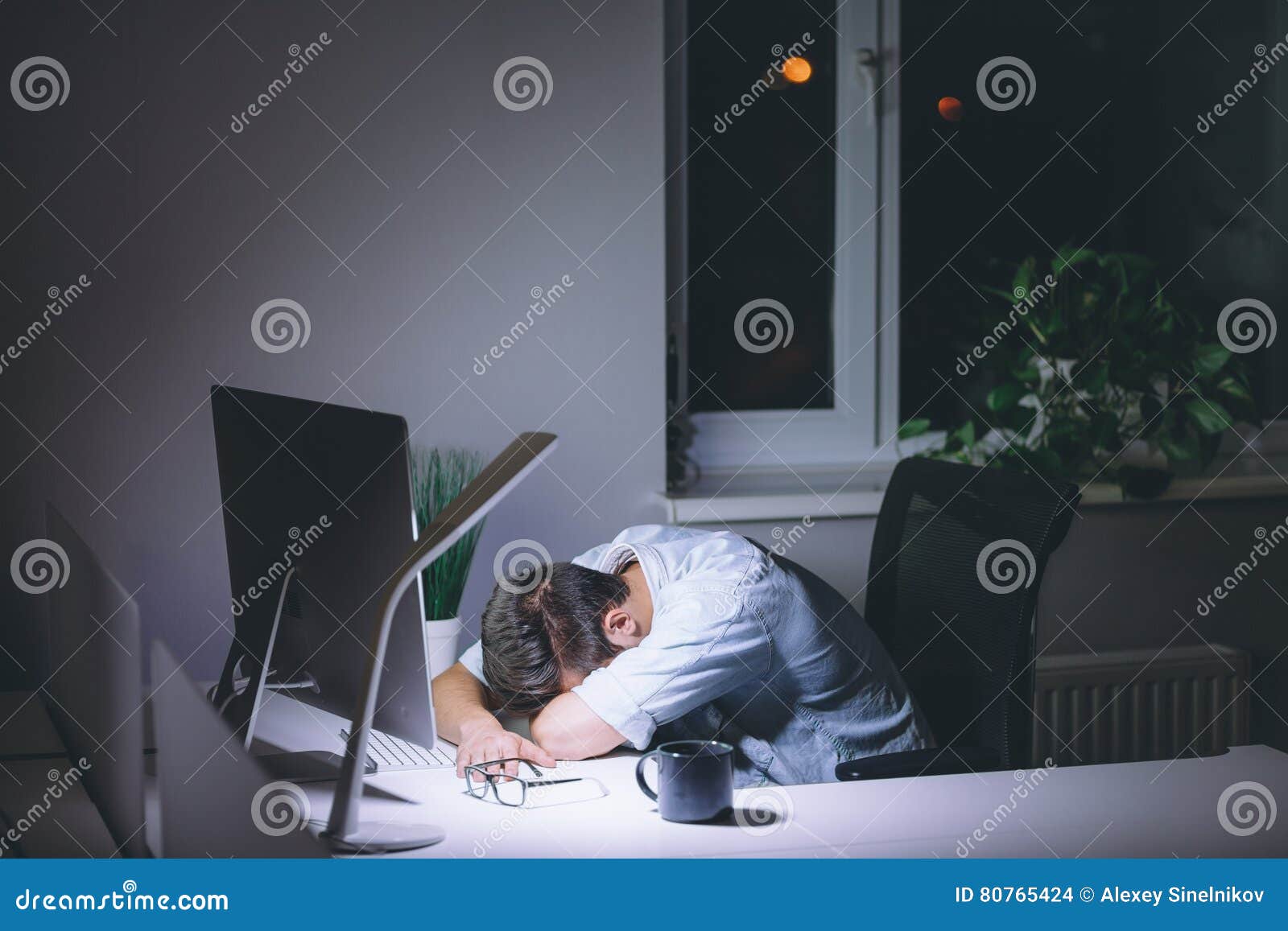 Sleeping Young Man Working on Computer at Night in Dark Office Stock ...