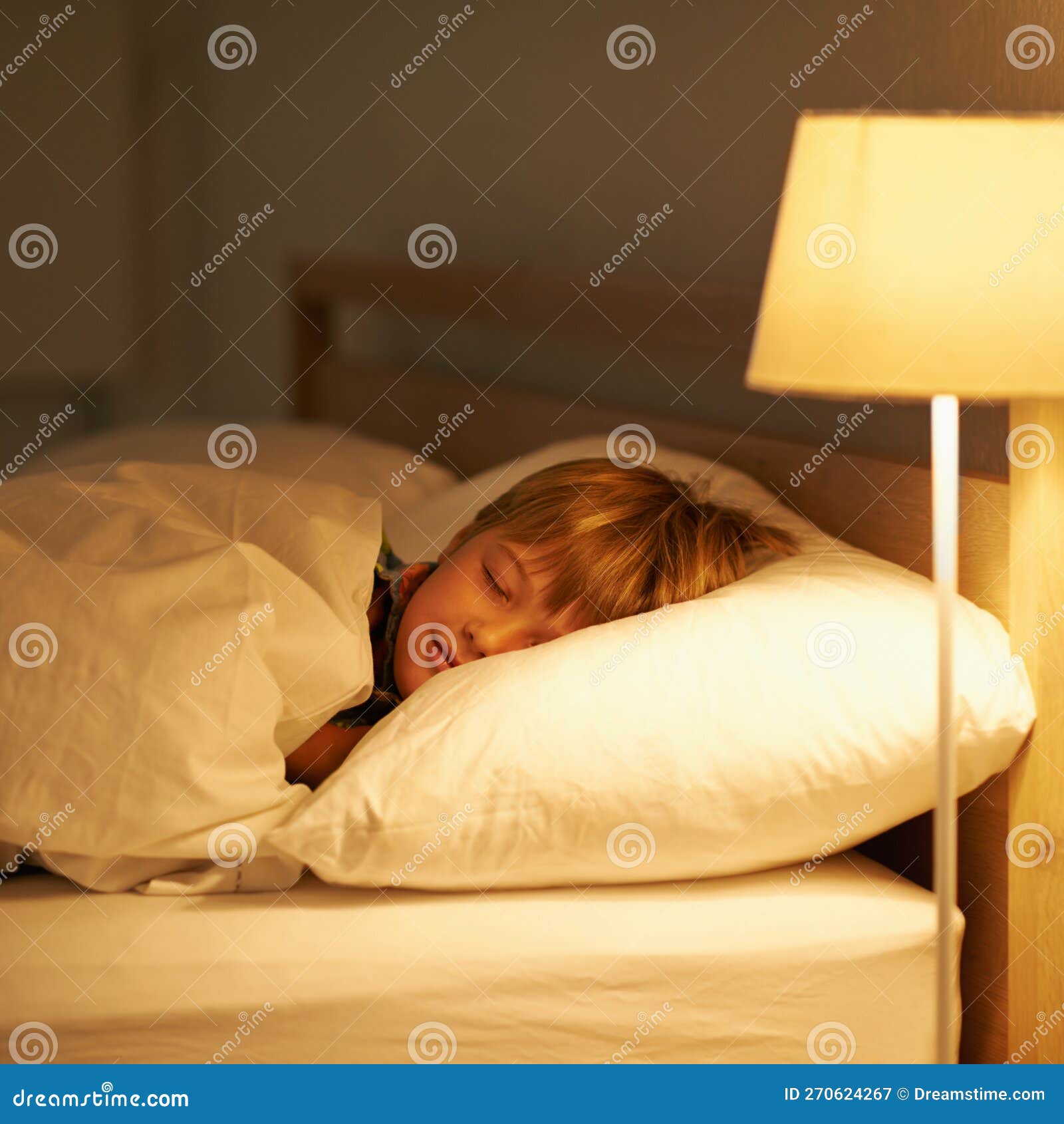 He always Sleeps so Peacefully. Shot of a Young Boy Sleeping in Bed ...