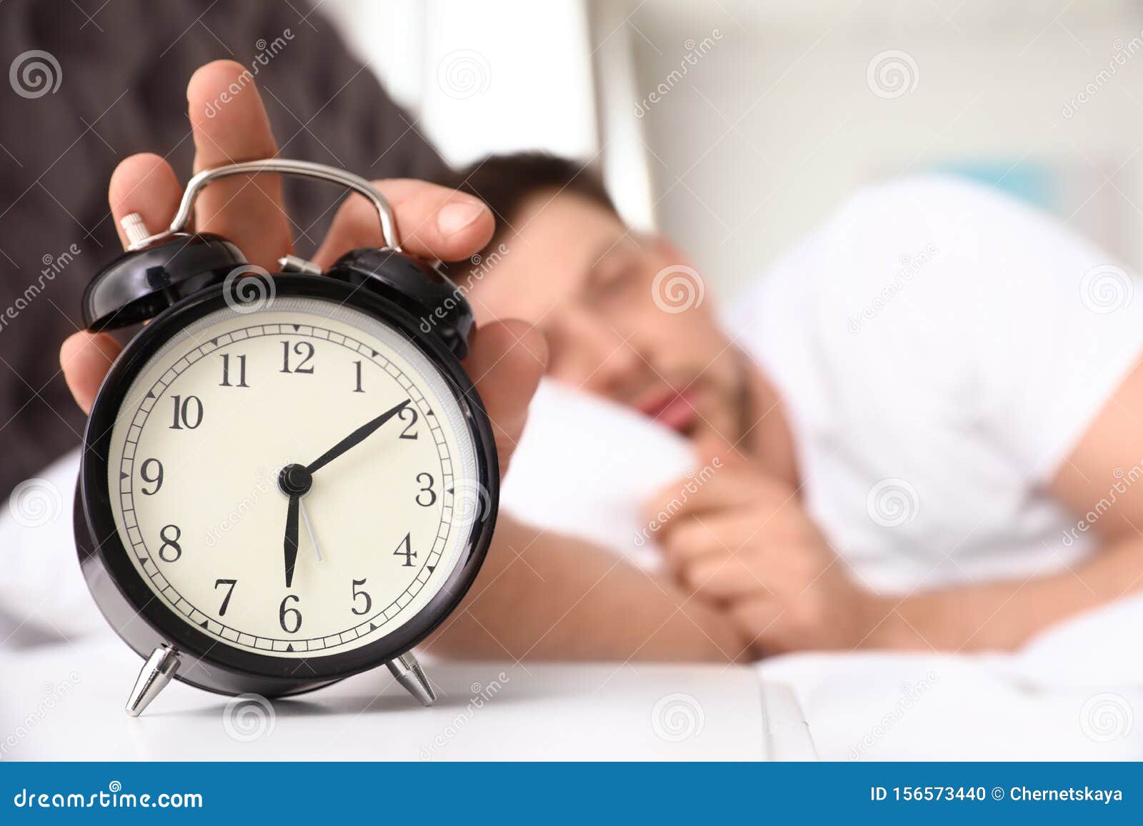 Sleepy Man Turning Off Alarm Clock on Nightstand Stock Photo - Image of ...