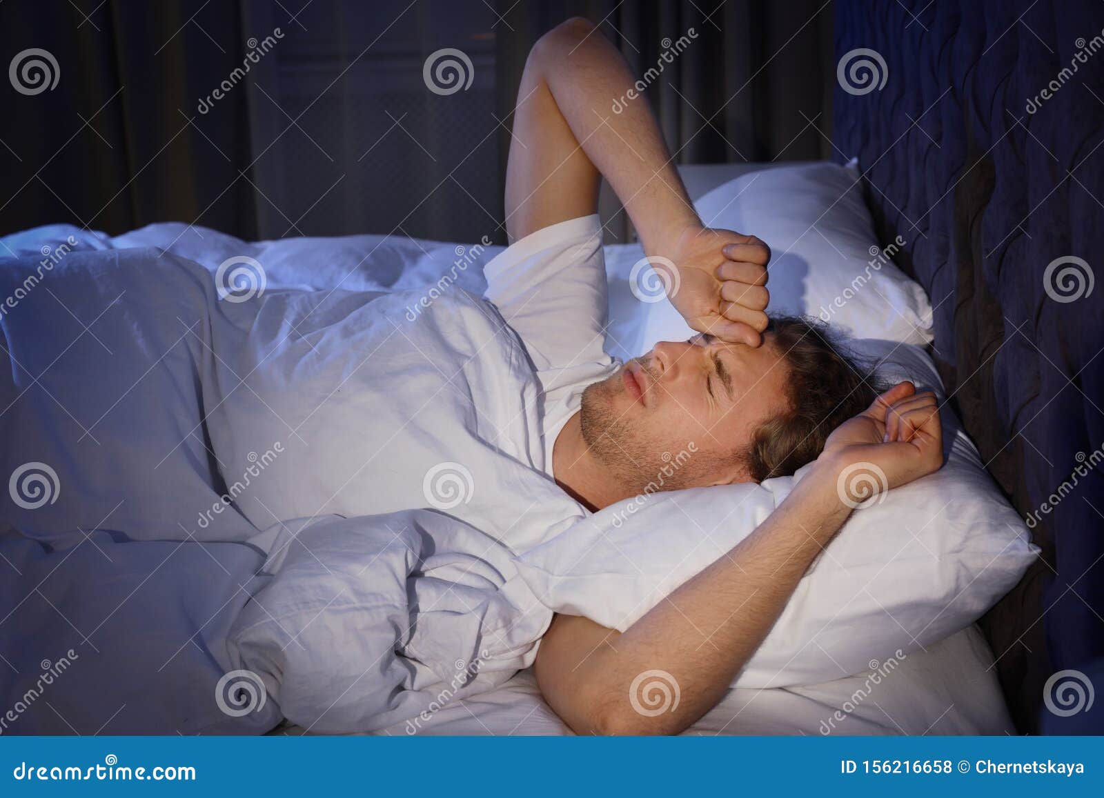 Sleepy Young Man Lying Under Blanket at Night Stock Photo - Image of ... Sleepy Young Man Lying Under Blanket at Night Stock Photo - Image of ...