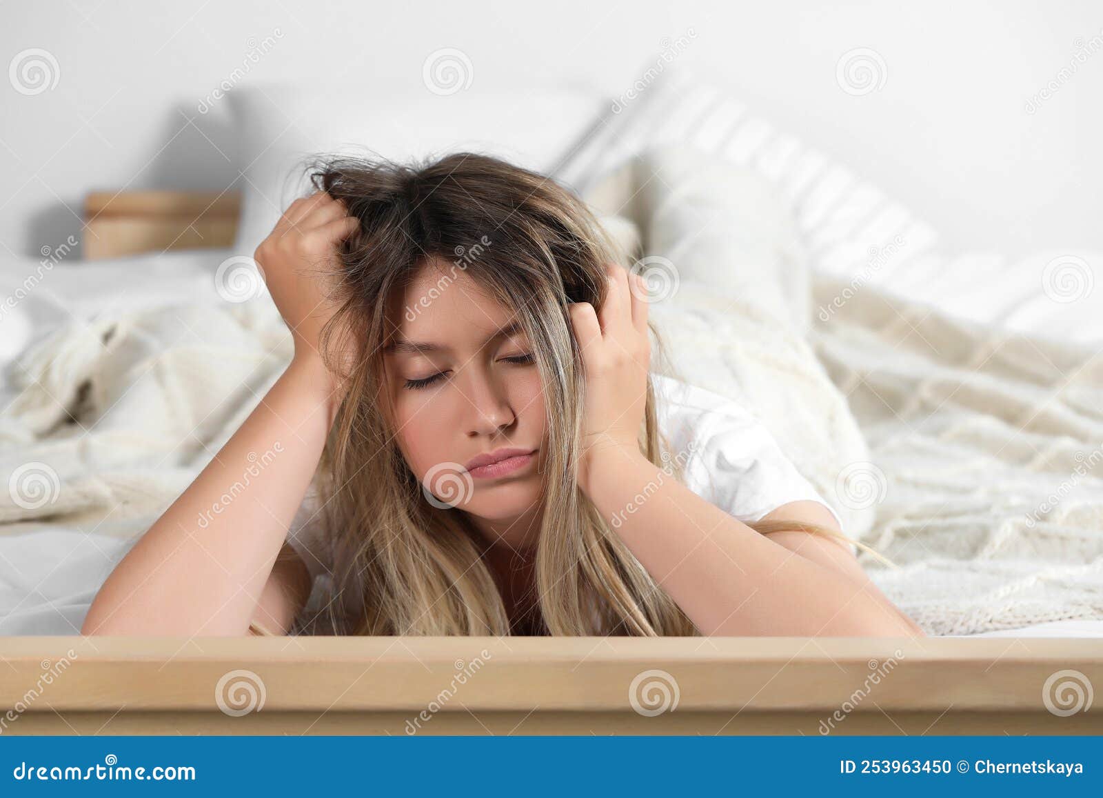 Sleepy young woman in bed stock photo. Image of blanket - 253963450