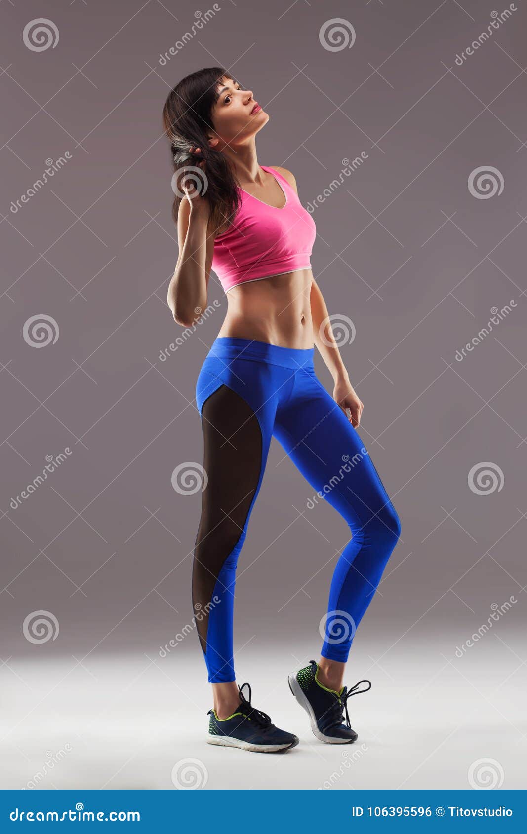 Slender Athlete Performs Exercises in the Studio Stock Photo - Image of ...