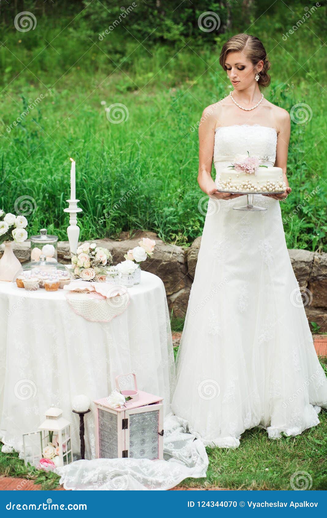 Slender Bride with a Cake in Her Hands Stock Photo - Image of hands ...