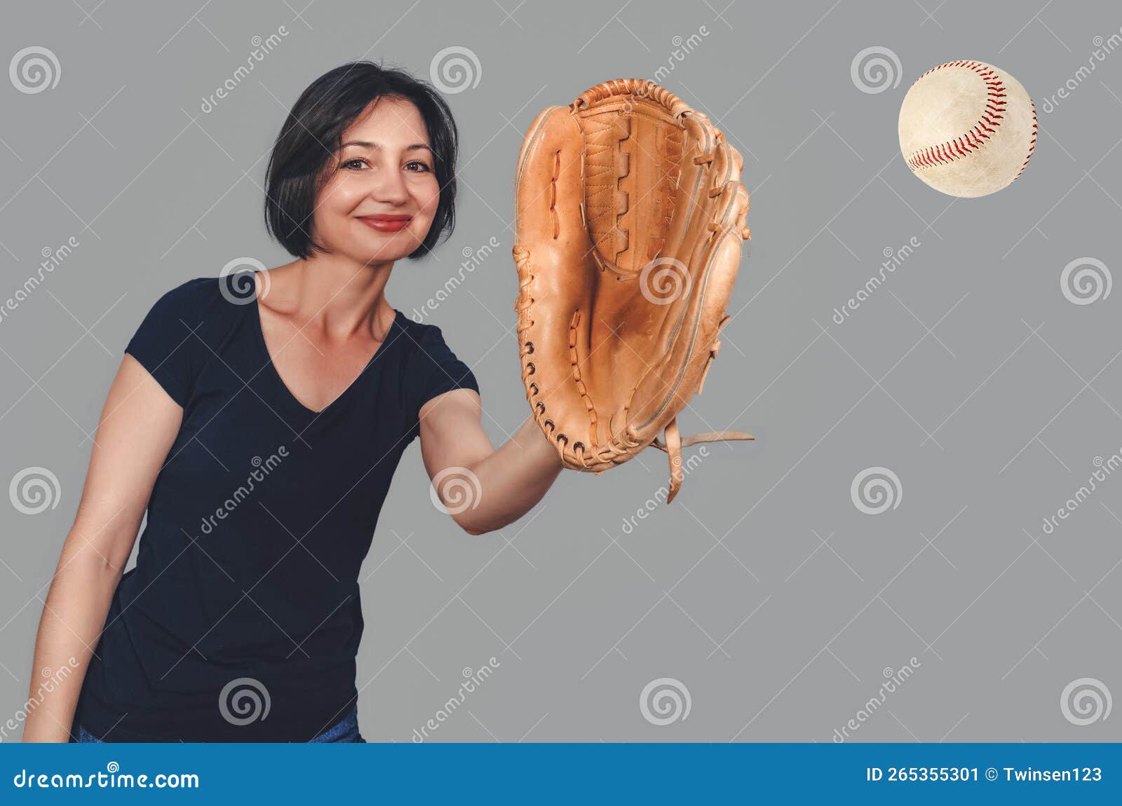 Slender Woman Catches a Baseball with a Baseball Glove Stock Image ...