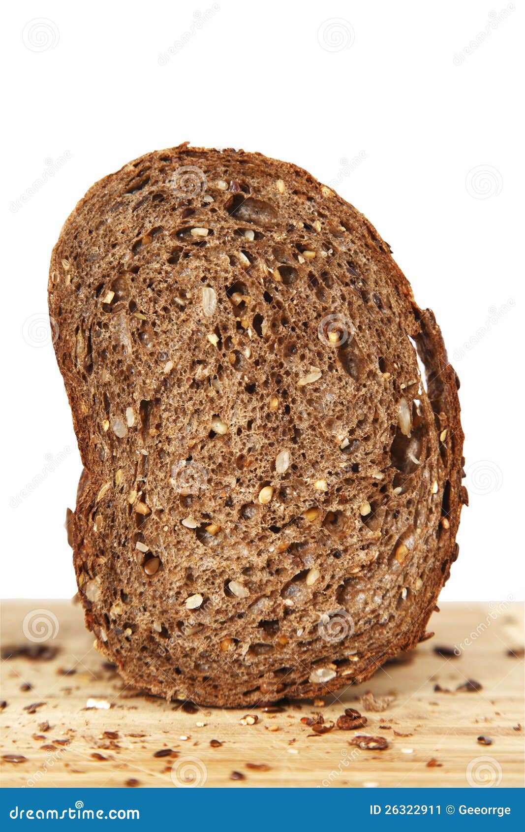 A slice of brown bread stock image. Image of form, grain - 26322911