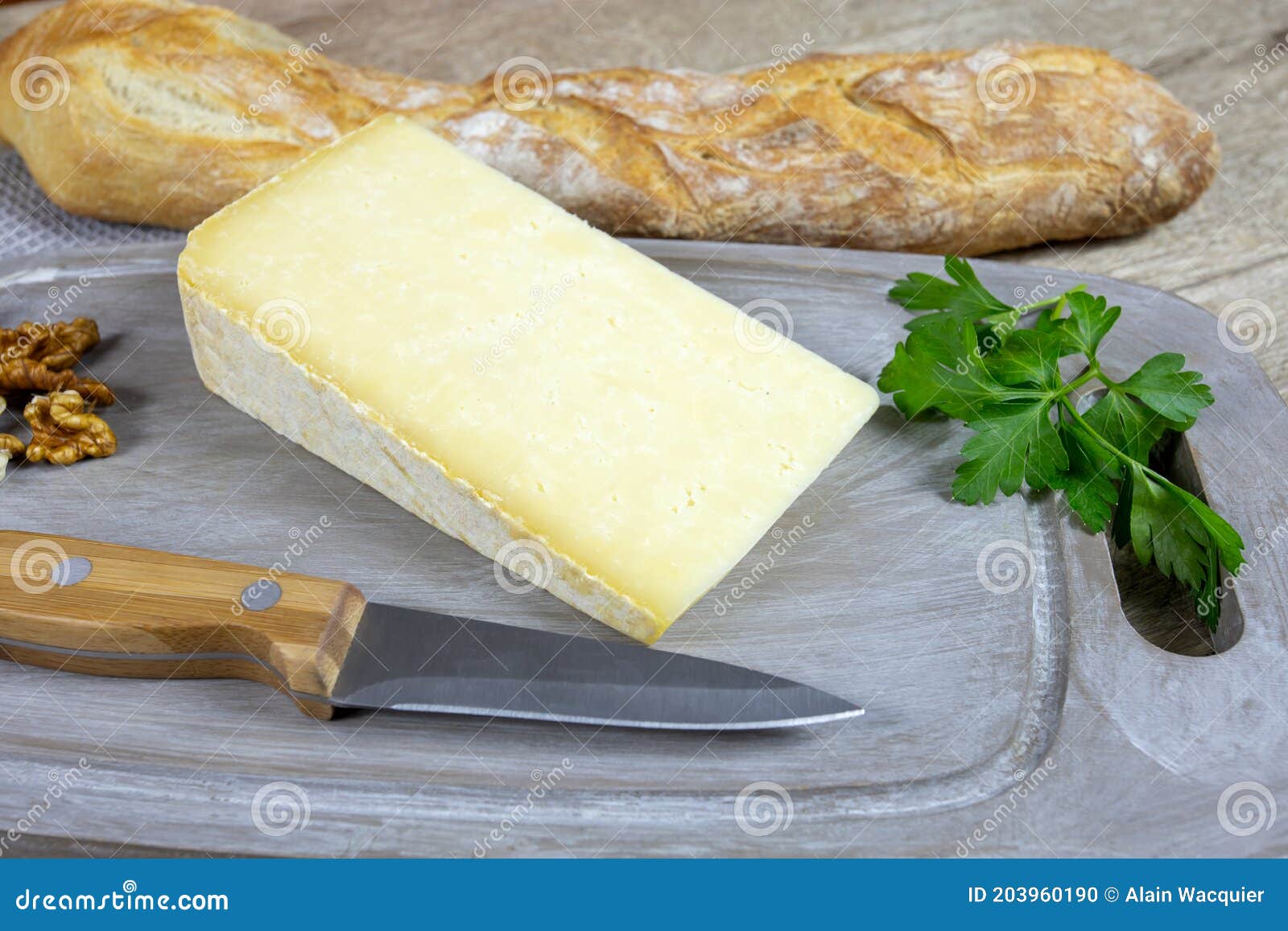Slice of Cantal Cheese on a Table Stock Photo - Image of board, france ...