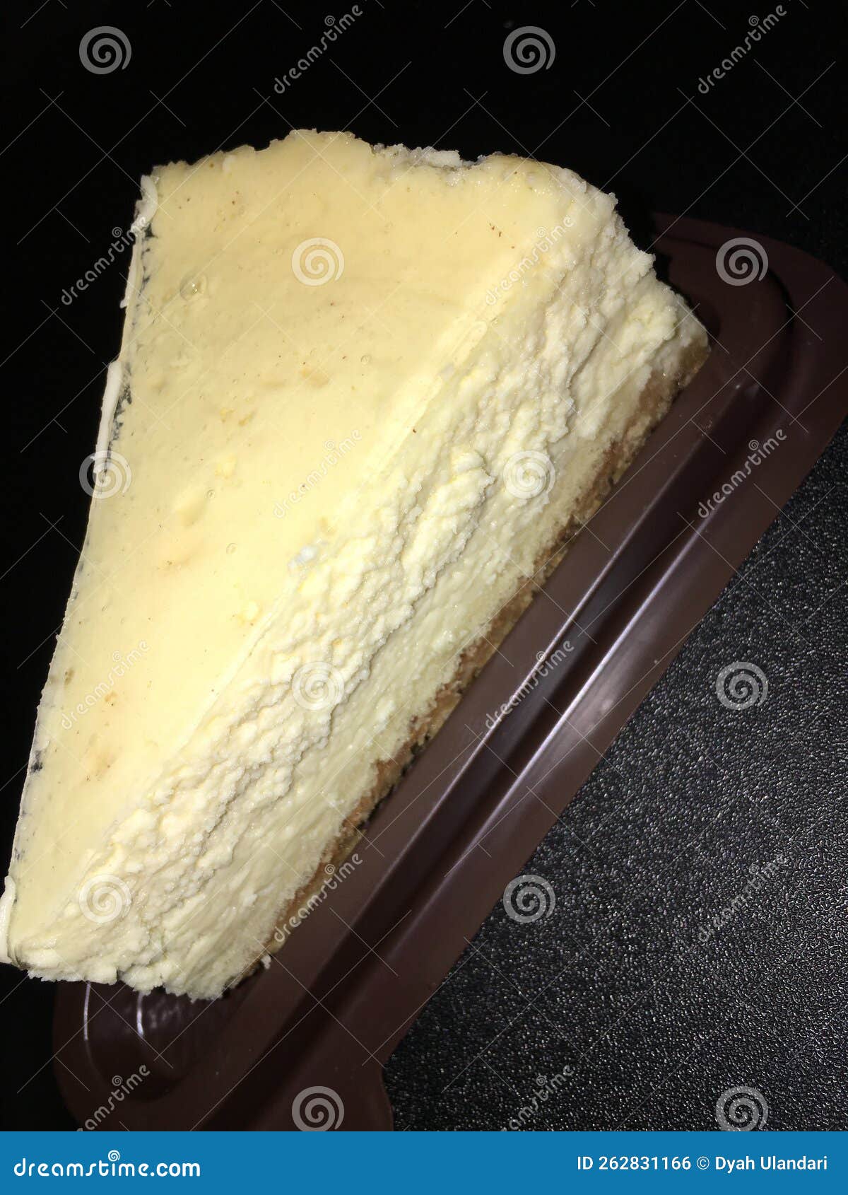 A slice of Cheesecake stock photo. Image of yummy, sweettooth - 262831166