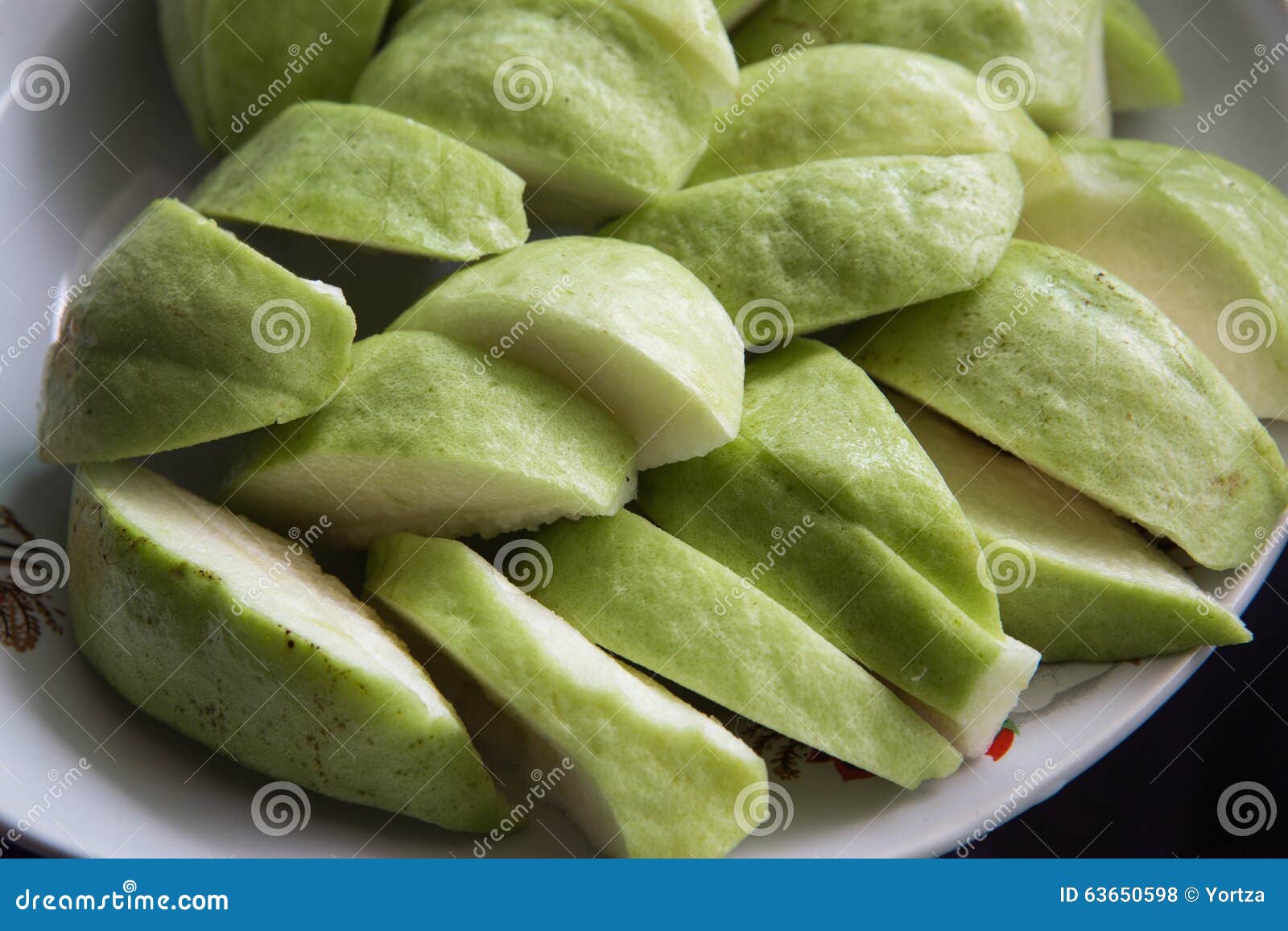 Slice of guava on dish stock photo. Image of healthy - 63650598